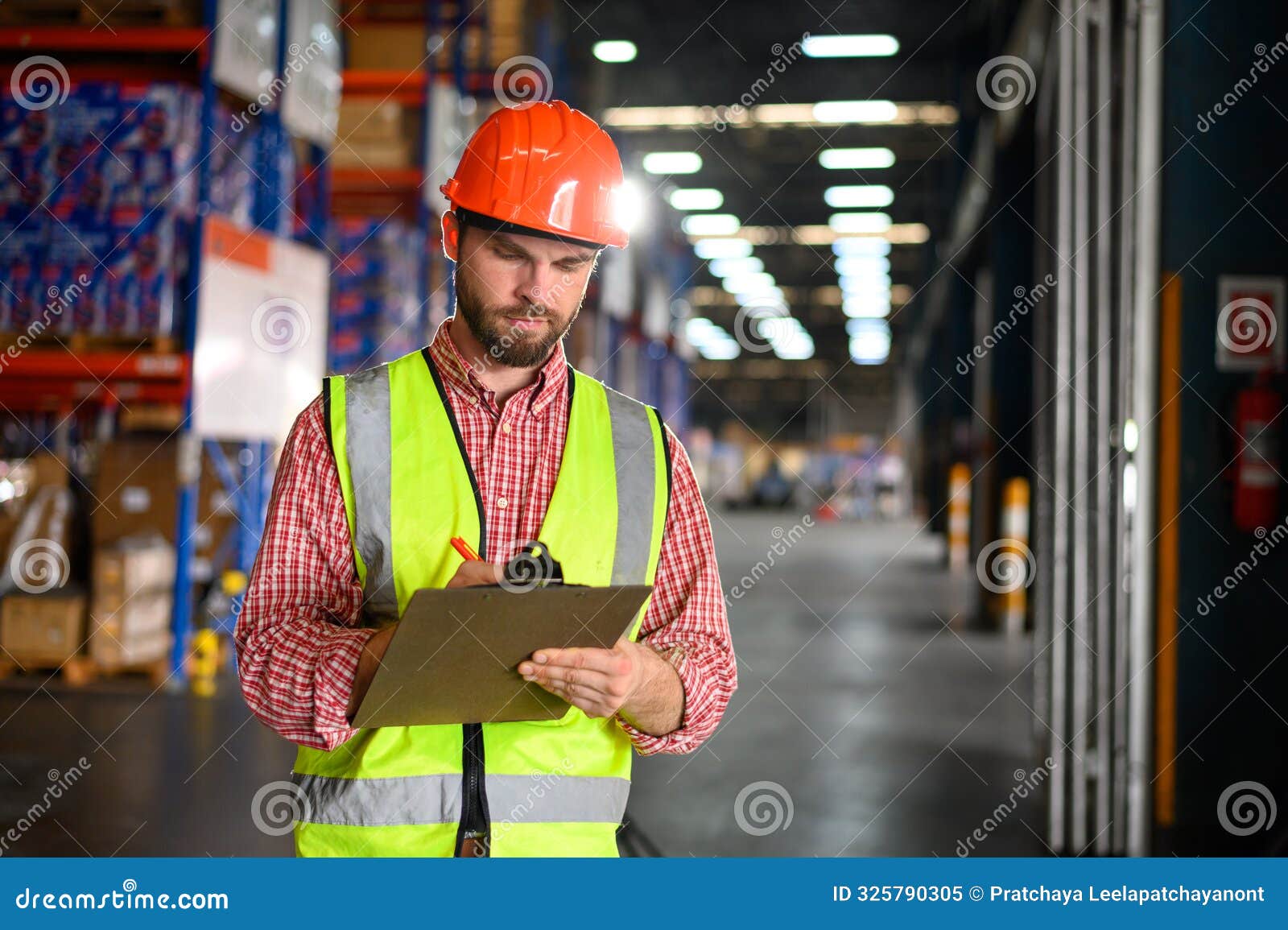 Factory Workers in Safety Uniforms Inspect and Check Inventory in ...