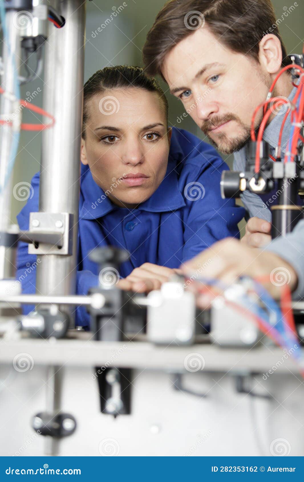 Factory Workers Solving Problem Together Stock Photo - Image of steel ...