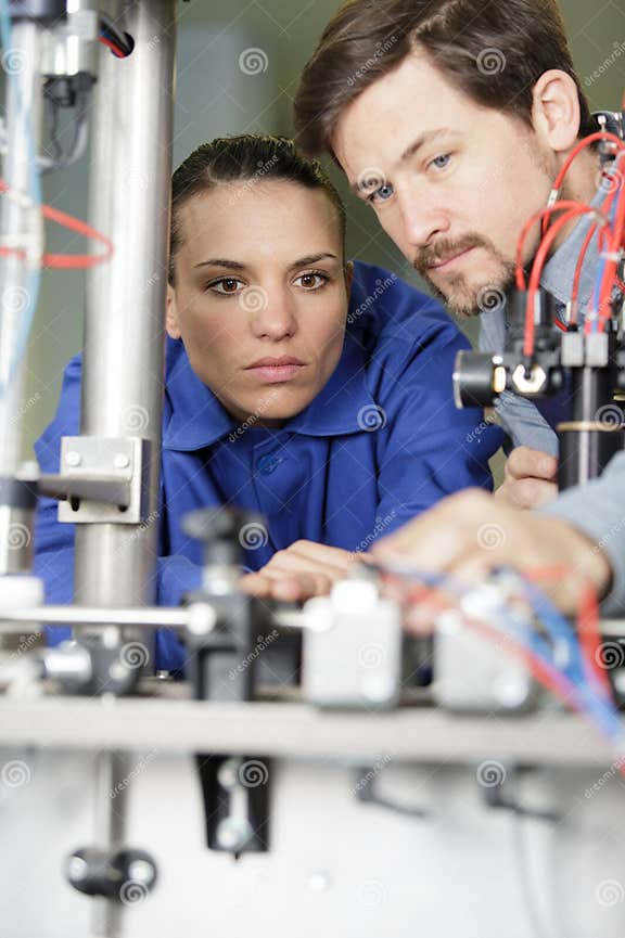 Factory Workers Solving Problem Together Stock Photo - Image of steel ...
