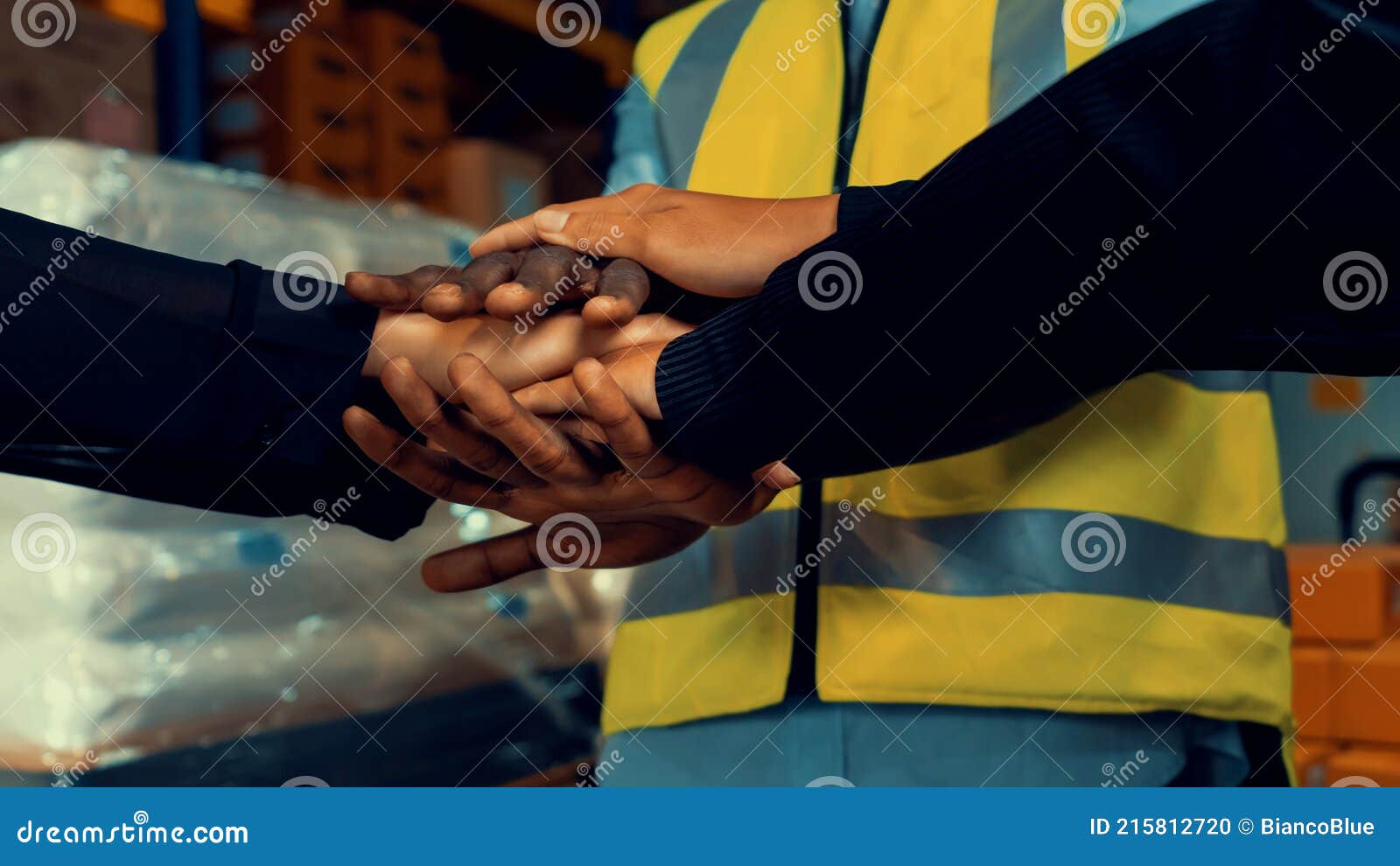 Factory Workers Stacking Hands Together in Warehouse or Storehouse ...