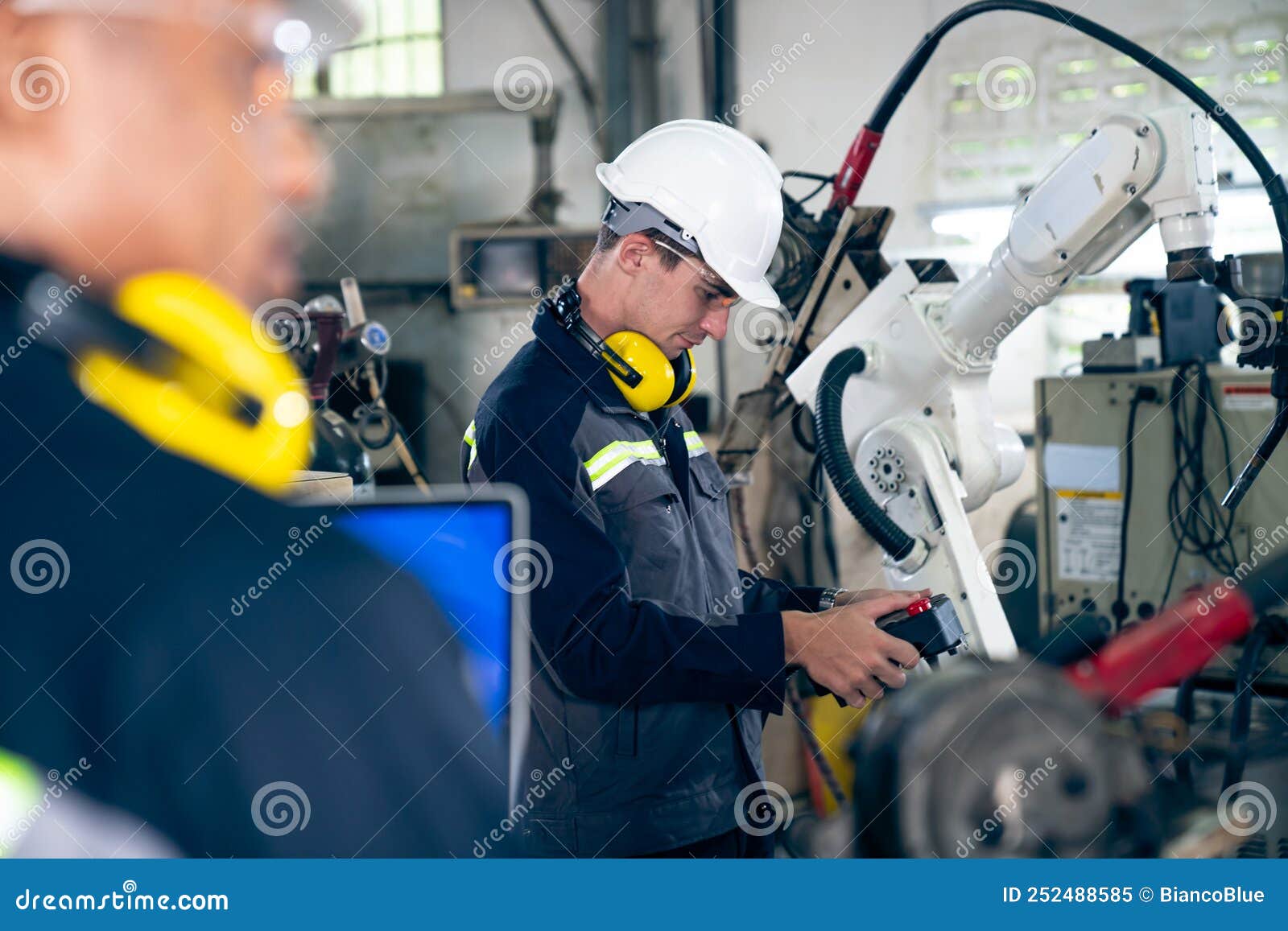 Factory Workers Working with Adept Robotic Arm in a Workshop Stock ...