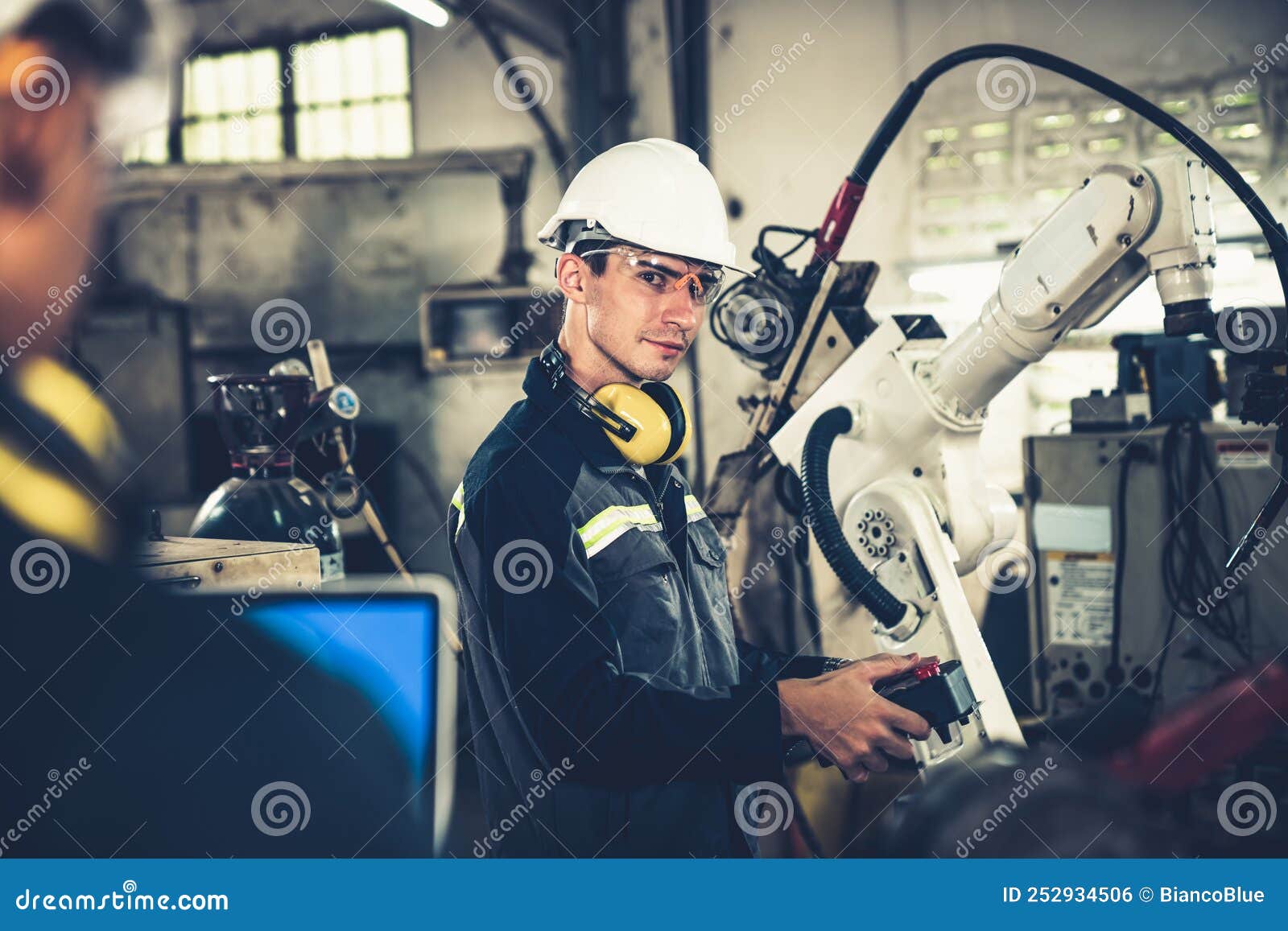 Factory Workers Working with Adept Robotic Arm in a Workshop Stock ...