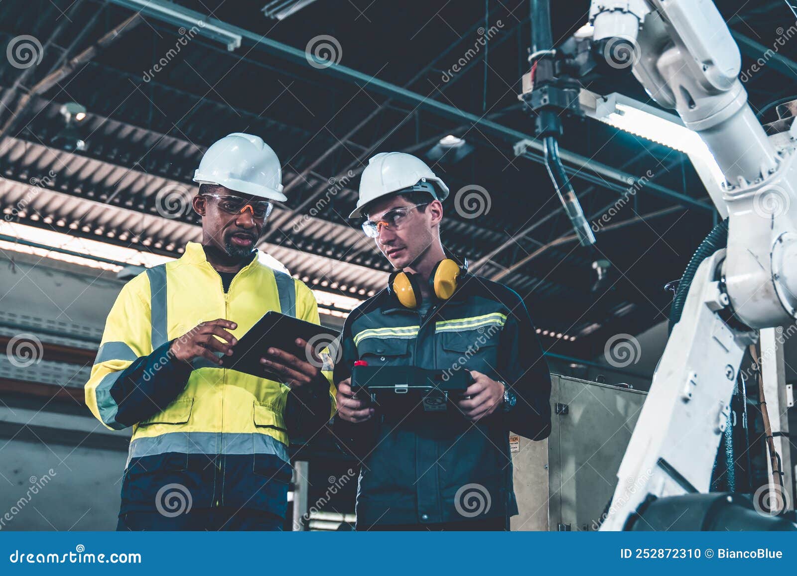 Factory Workers Working with Adept Robotic Arm in a Workshop Stock ...