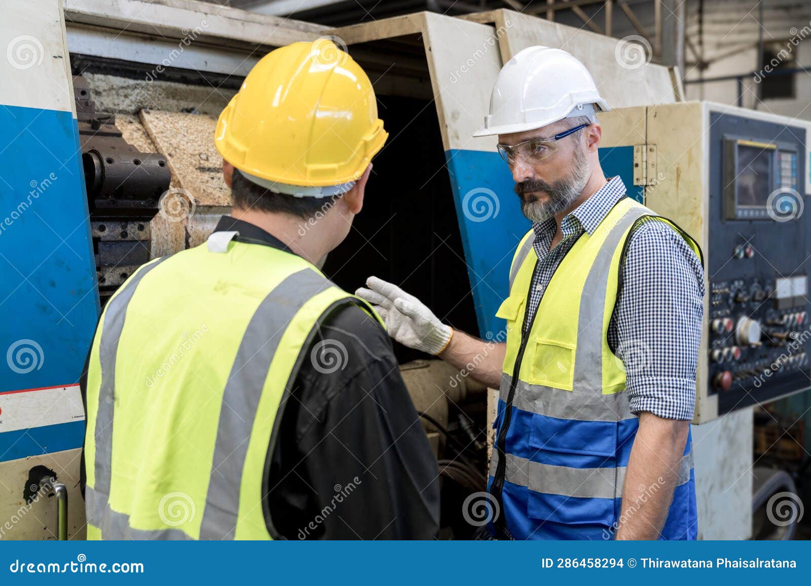 Factory Workers Working and Discussing in Factory. Engineer Men Wearing ...