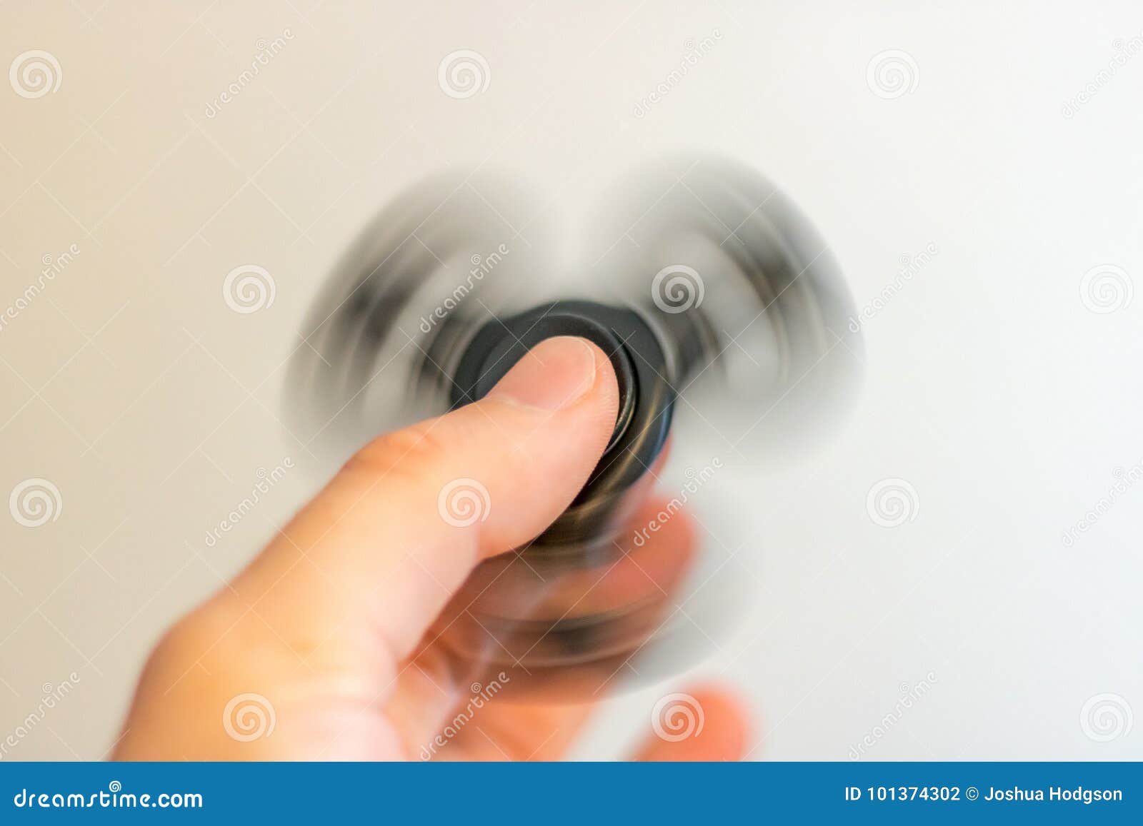 Spinning Fidget Spinner stock photo. Image of fade, spinning - 101374302