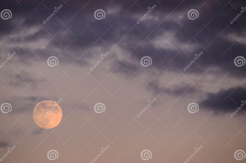 Faded Full Moon during a Cloudy Sunset Day Stock Image - Image of ...