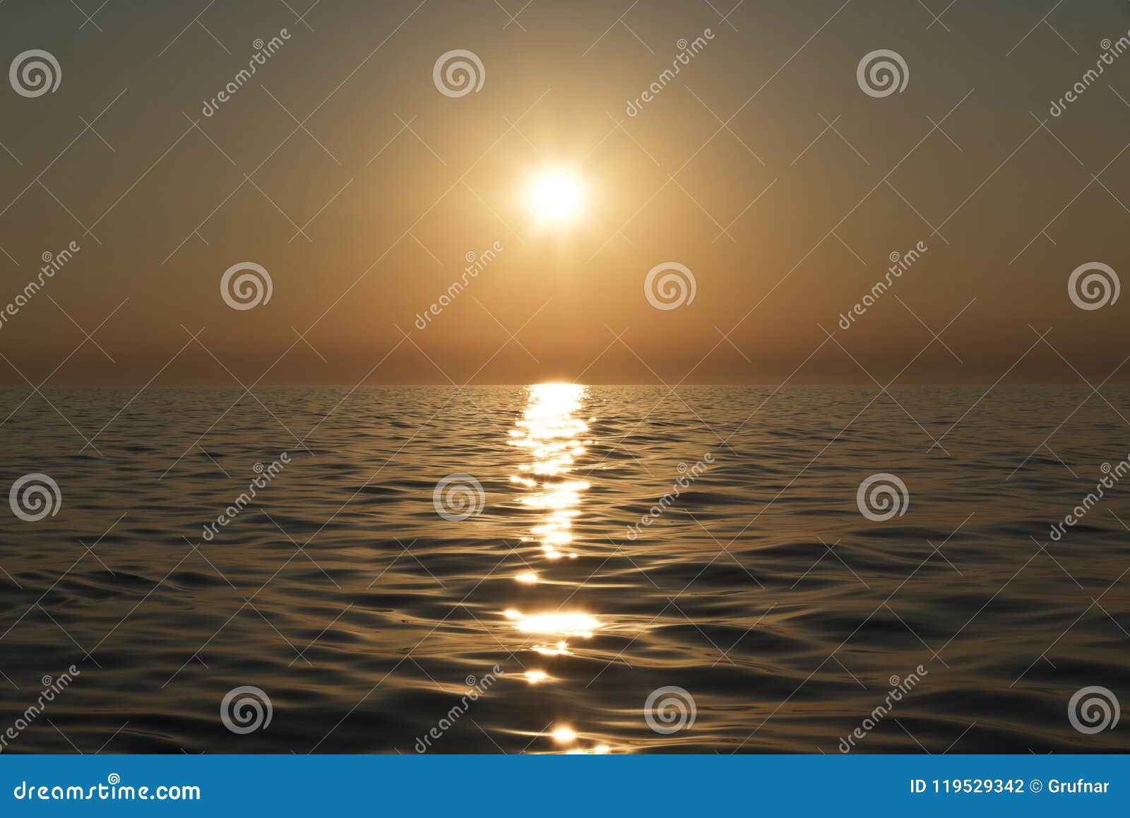 Fading sun over the water stock photo. Image of failing - 119529342