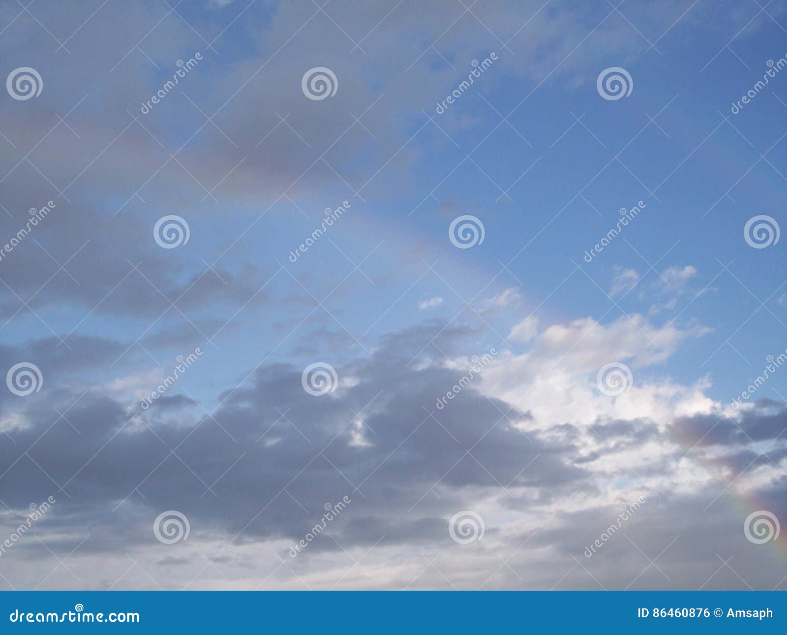 Faint Double Rainbow Against Blue Sky and Clouds Stock Photo - Image of ...