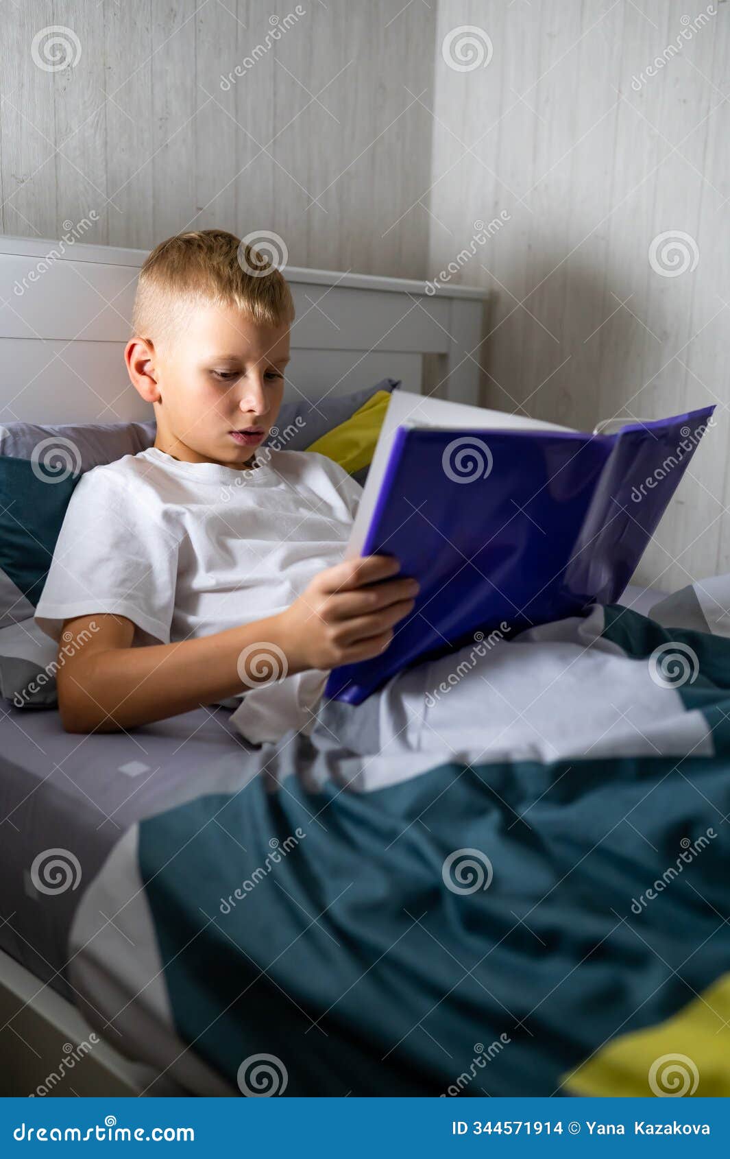 Fair-haired Teenage Boy Reading Book before Bed Stock Photo - Image of ...