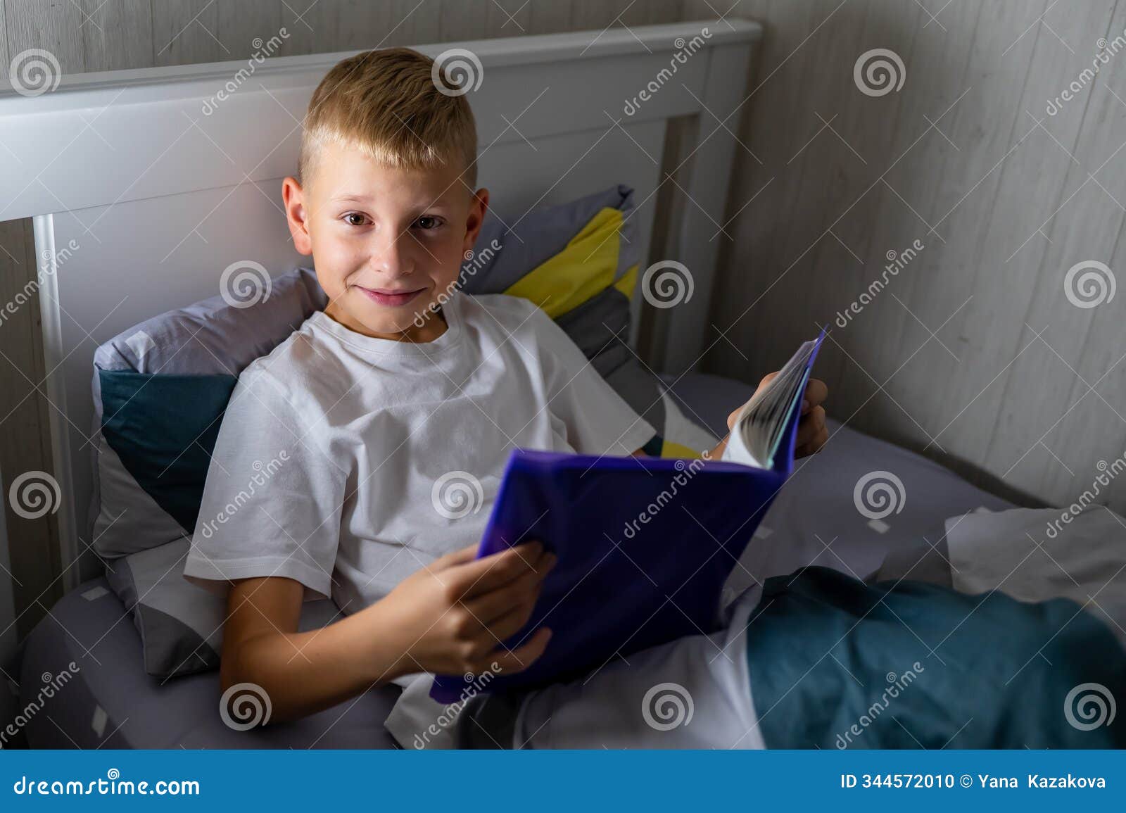 Fair-haired Teenage Boy Reading Book before Bed Stock Photo - Image of ...