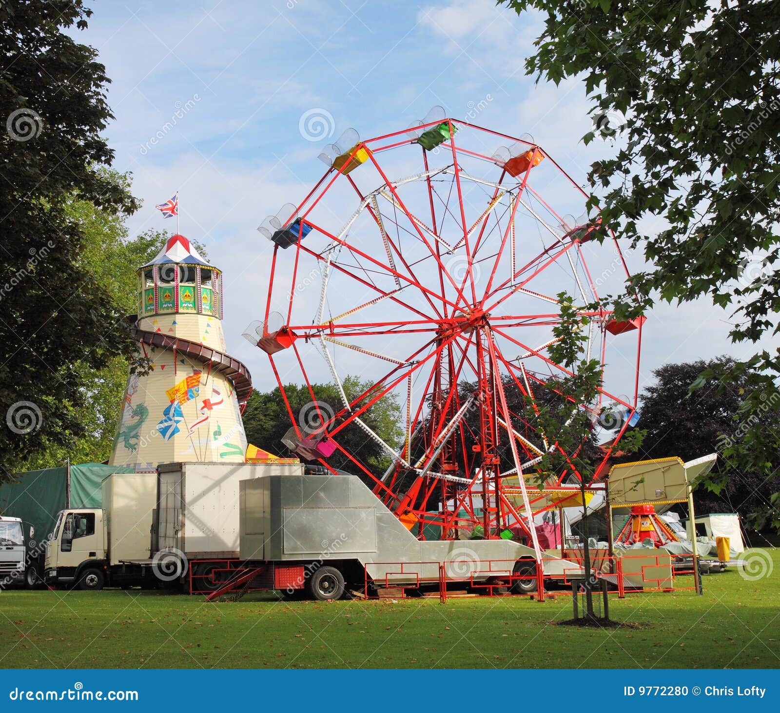 Fairground with Ferris Wheel Stock Photo - Image of trucks, skelter ...