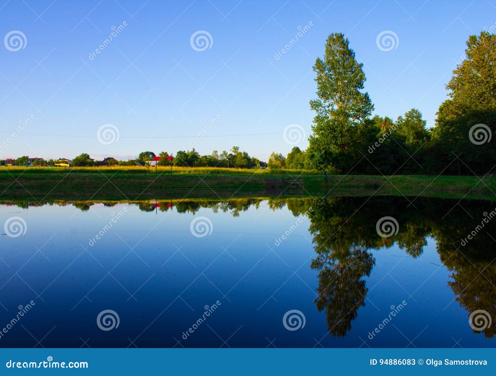 A Fairy-tale Lake in the Forest, the Trees are Reflected in the Water ...