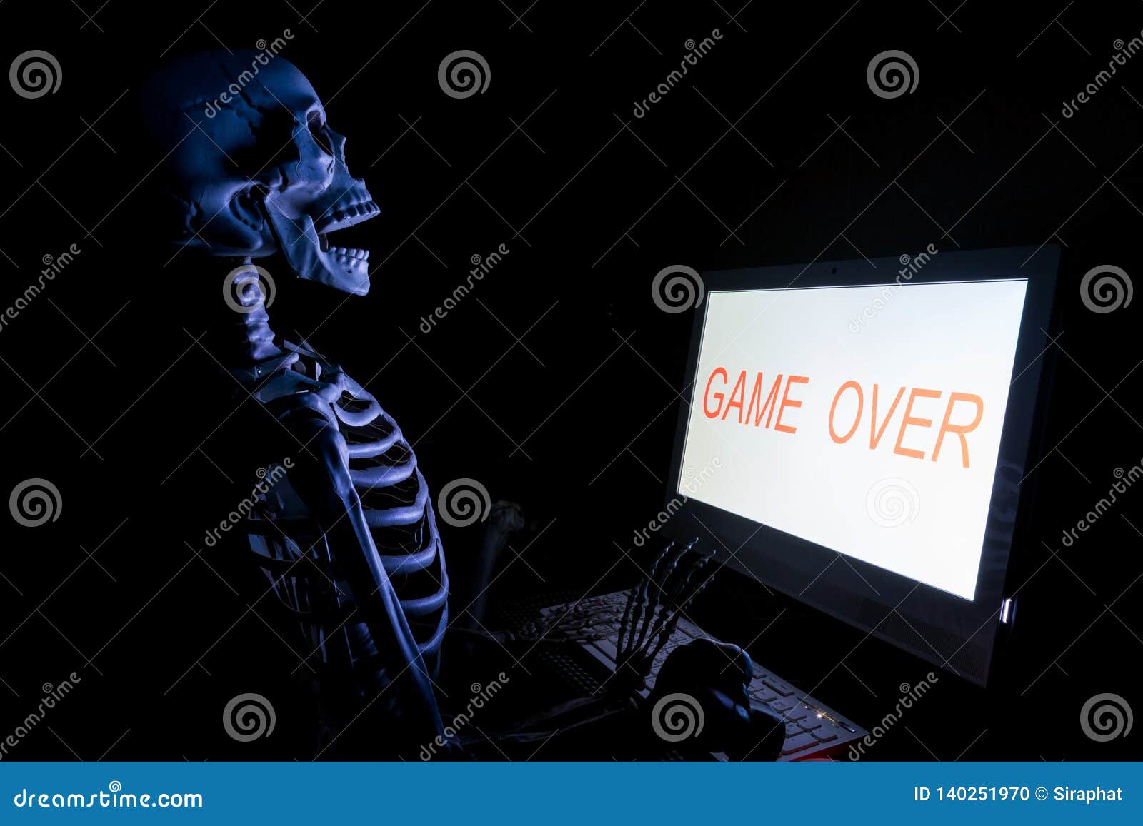 Fake Human Skeleton Sitting in Front of Desktop Computer. Stock Photo ...