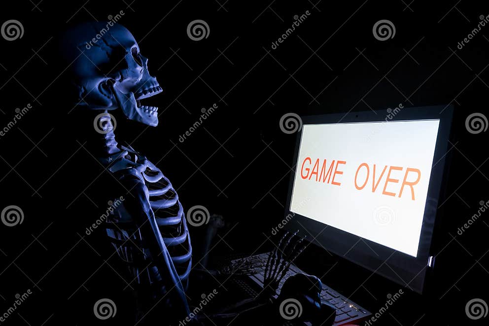 Fake Human Skeleton Sitting in Front of Desktop Computer. Stock Photo ...
