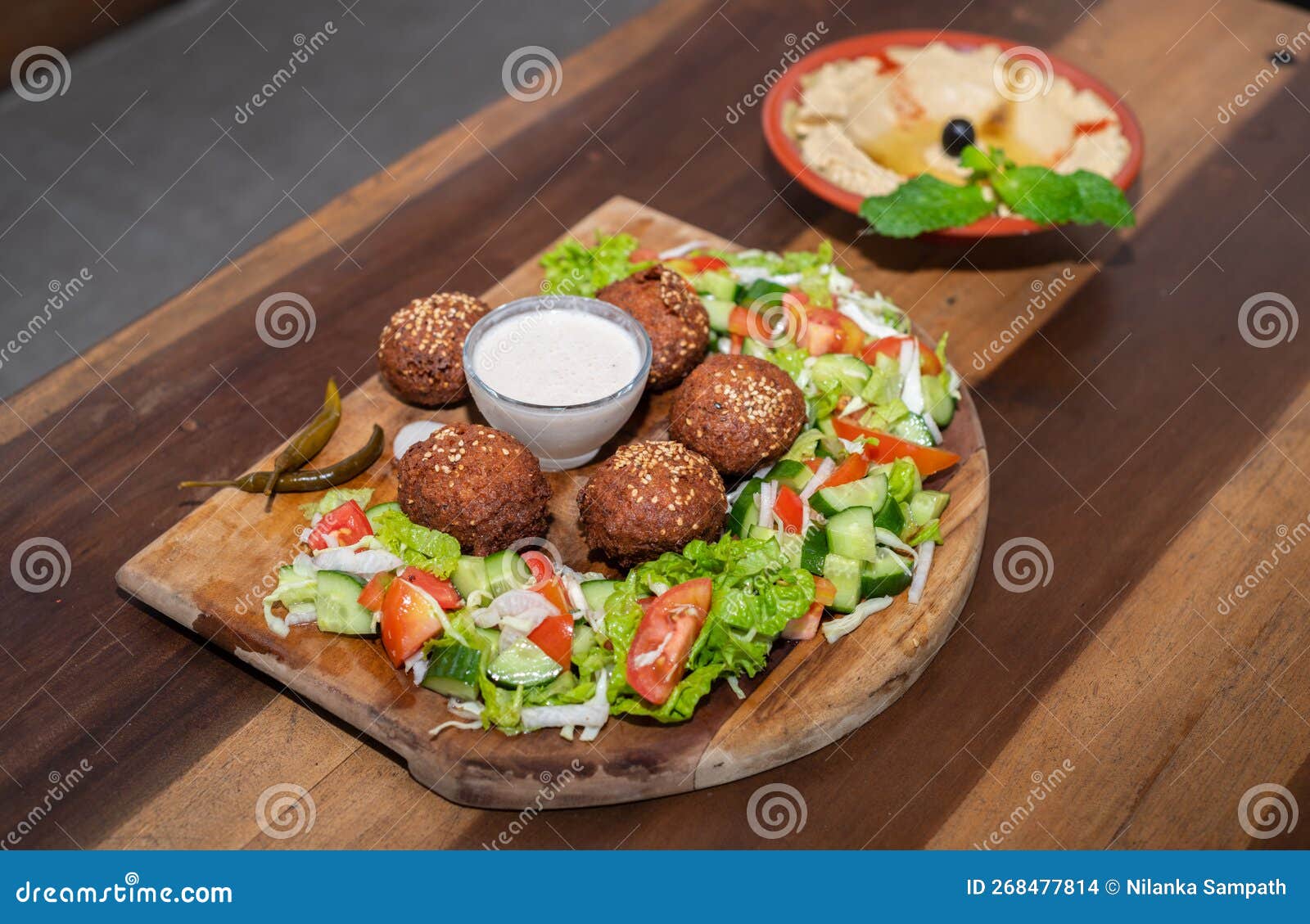 Falafel Plate with Vegetables Salad and Sauce on the Table Stock Photo ...