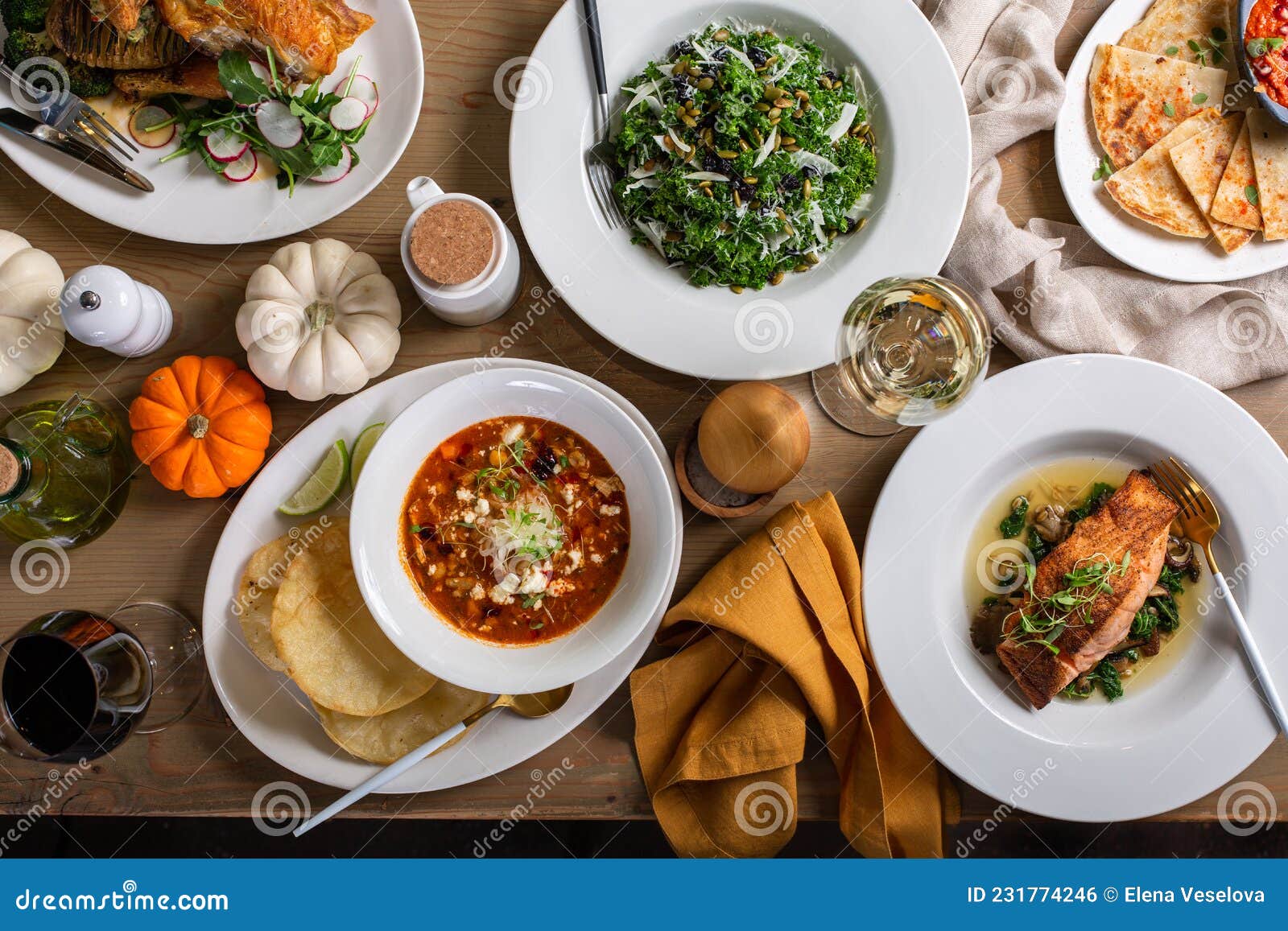 Fall Dinner Table Overhead Shot with Salad and Entrees Stock Photo ...