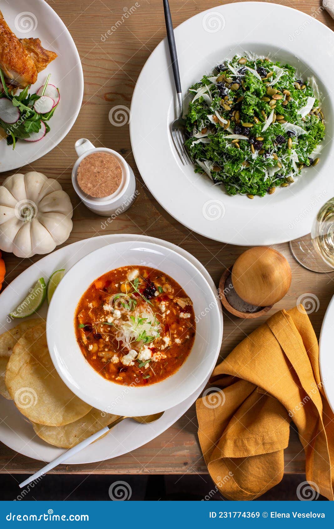 Fall Dinner Table Overhead Shot with Salad and Entrees Stock Image ...