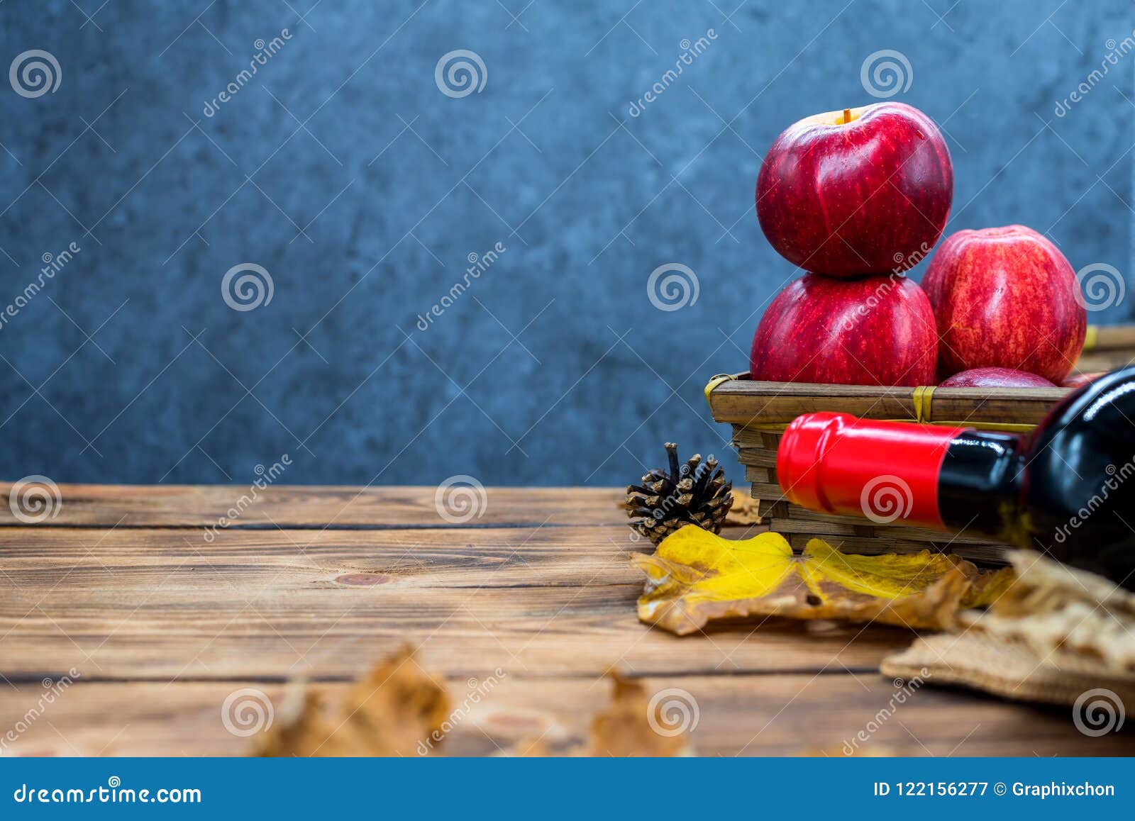 Fall Harvest Cornucopia. Basket with Red Apple and Wine on the Table ...