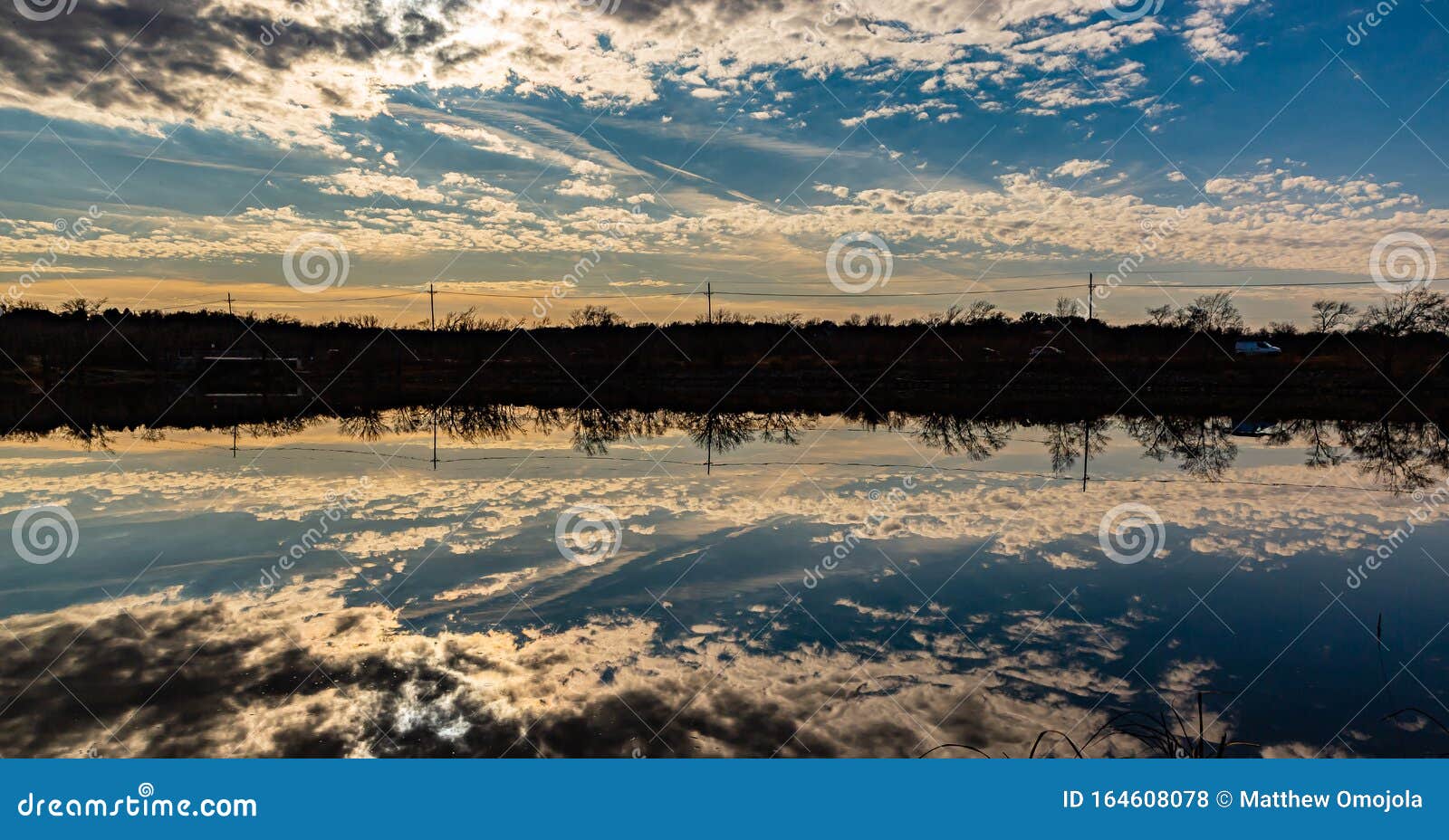 Fall Reflections in the Lake with Beautiful Skyline and Cloud Stock ...
