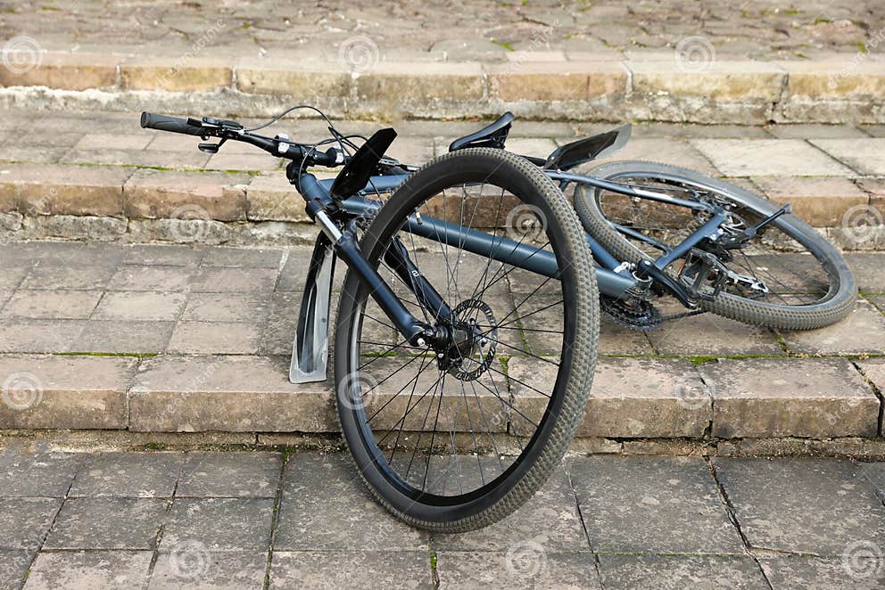 Fallen Beautiful Modern Bicycle on Steps Outdoors Stock Image - Image ...