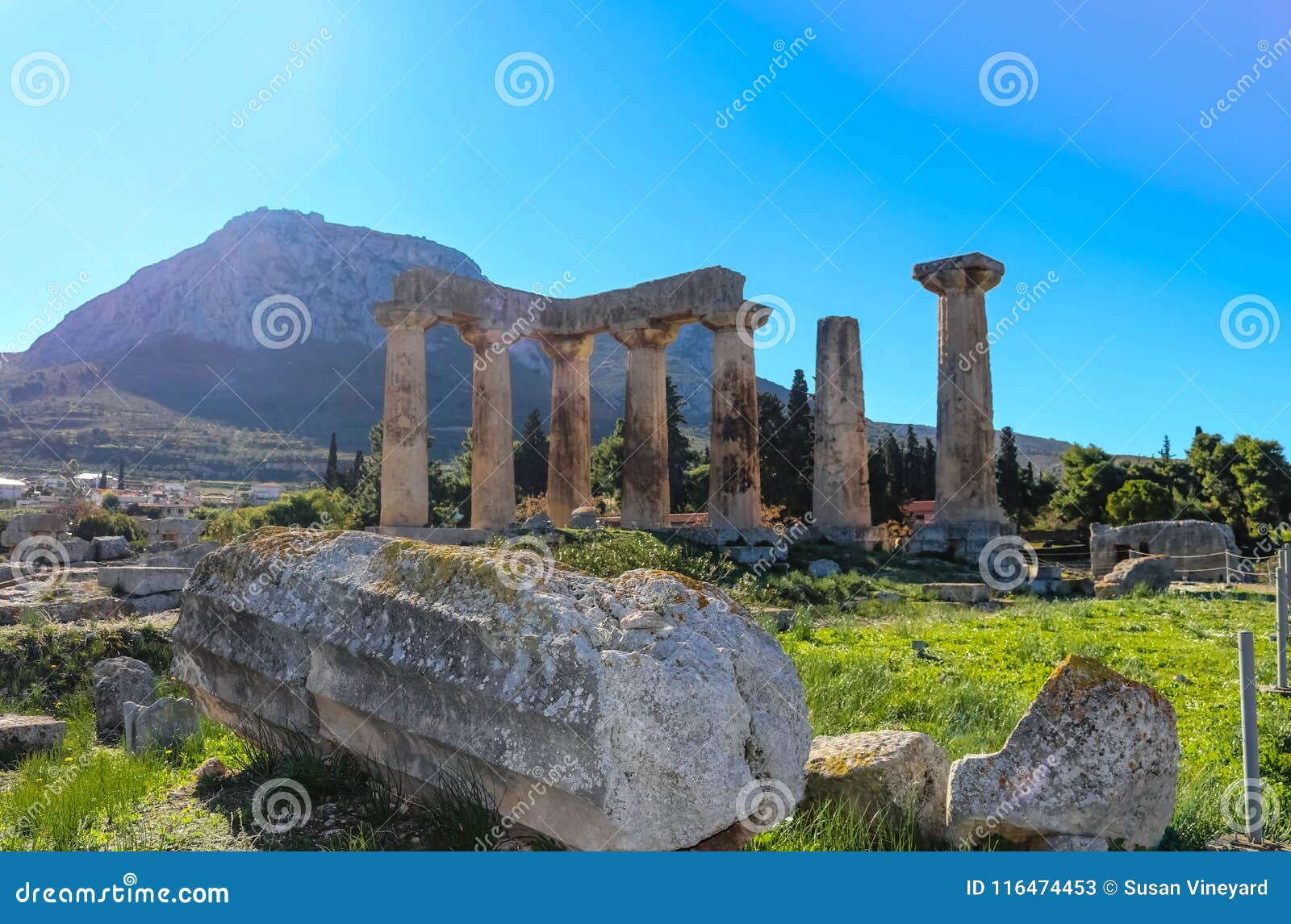 Fallen Broken Pillar Laying On Ground In Front Of The Ruins Of The ...