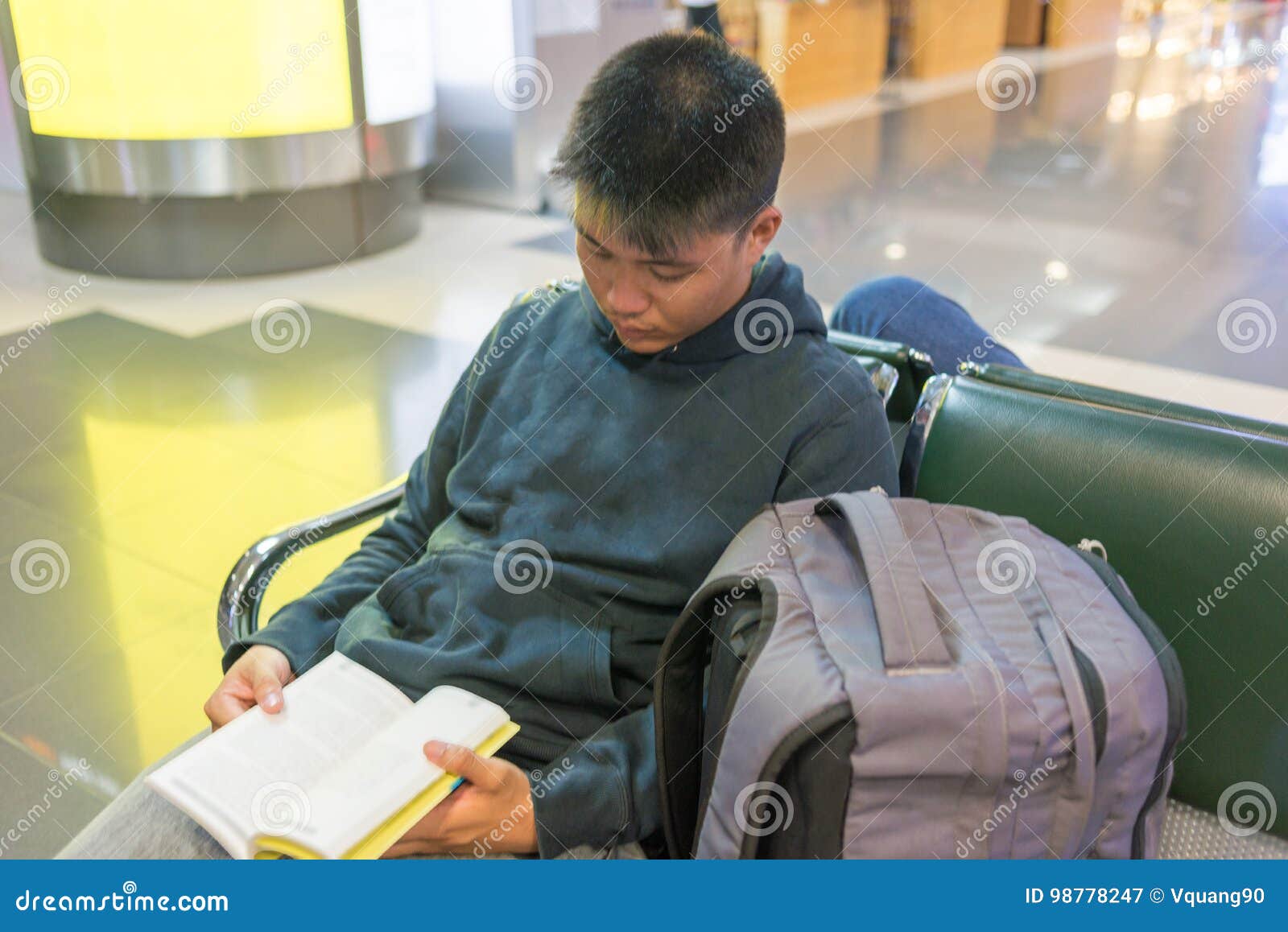 Falling Asleep with a Book on Hand and Backpack beside Stock Image ...