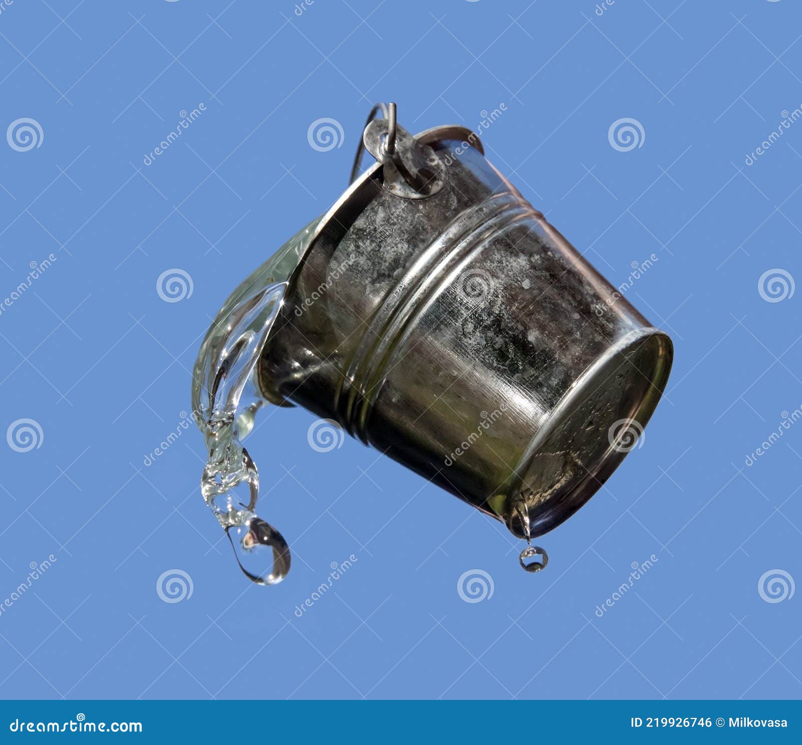 A Falling Buckets Splashes Water, on a Background of Blue Sky Stock ...