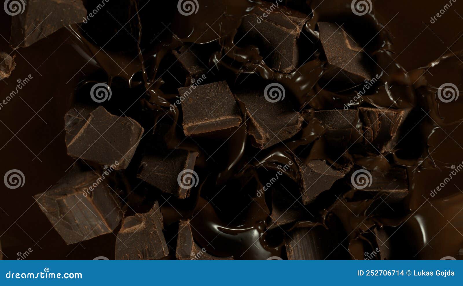 Falling Chocolate Chunks into Dark Hot Melted Chocolate Stock Photo ...