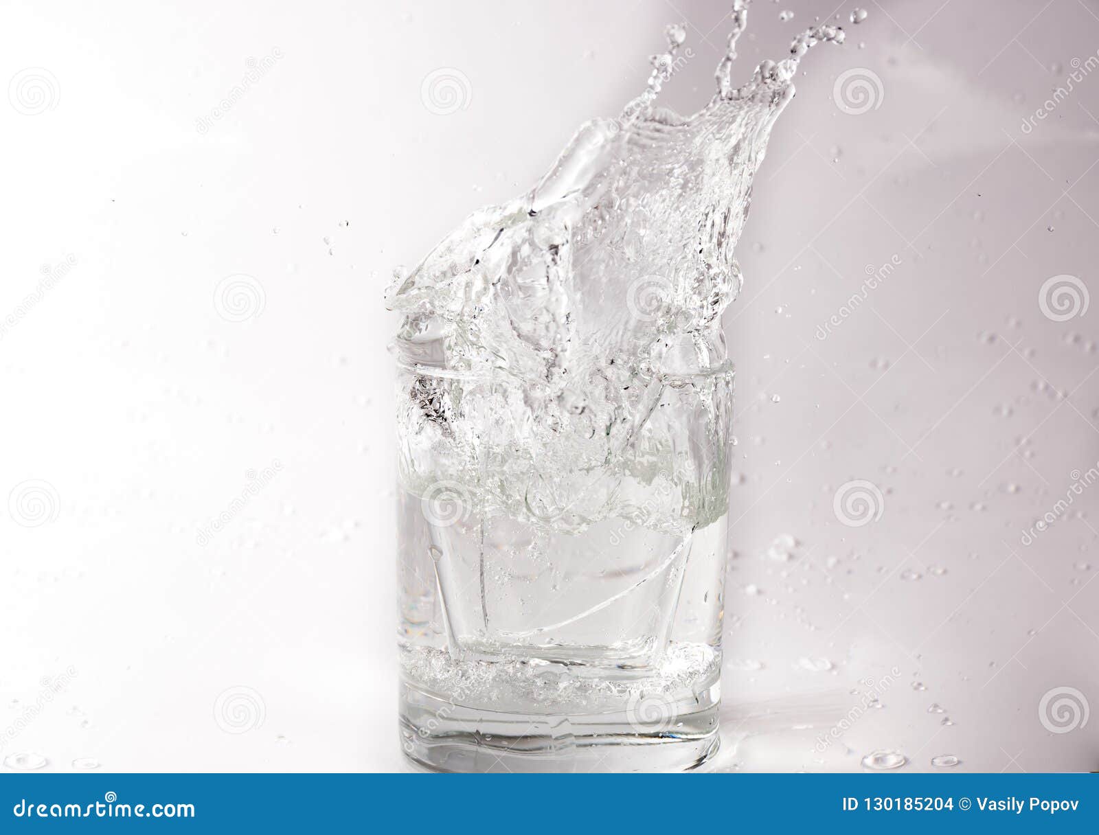 Falling and Crashing Glass of Water. Shards of Glass and Splashing ...