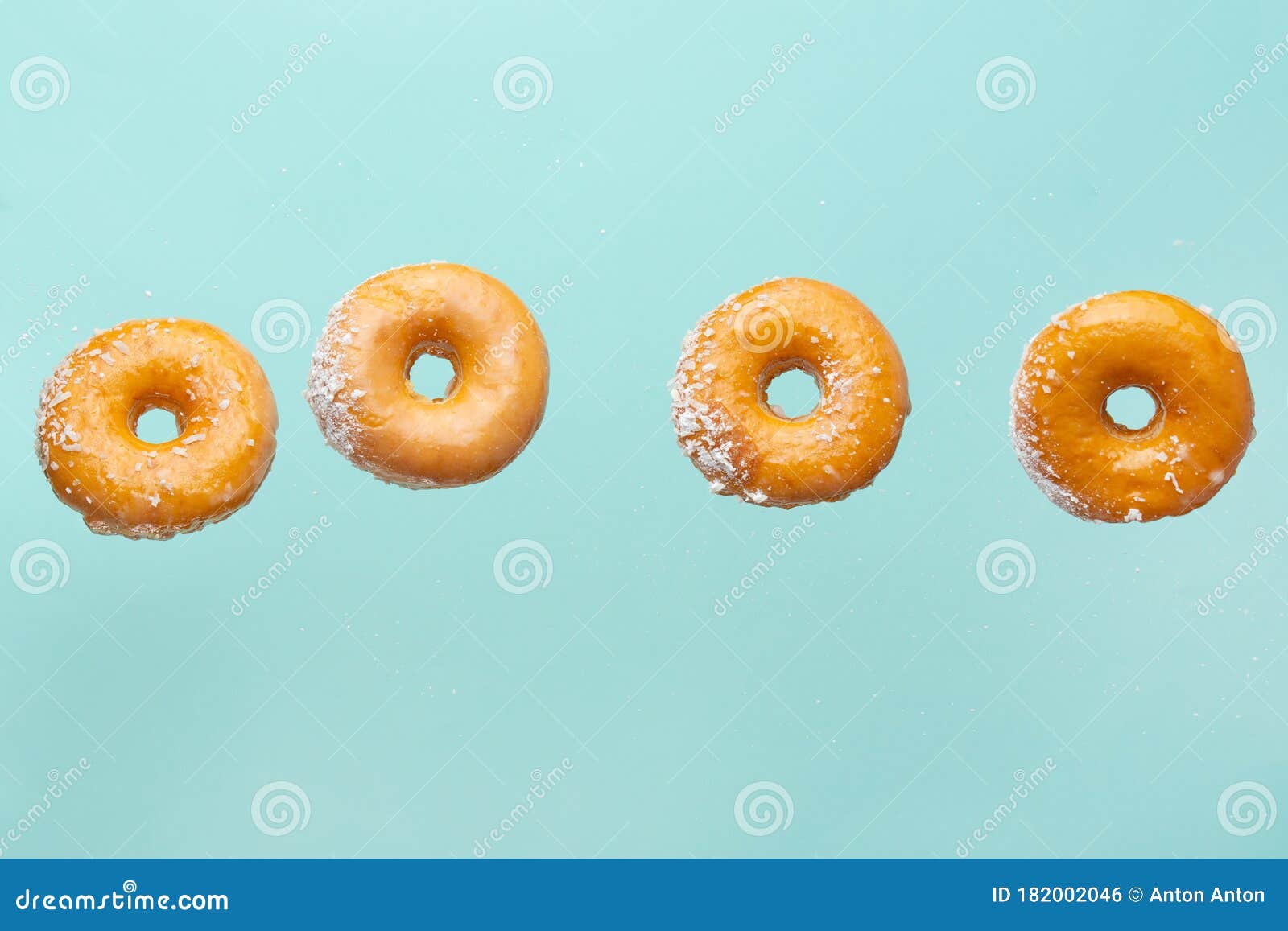 Falling Donuts in a Glaze on a Blue Background Stock Photo - Image of ...
