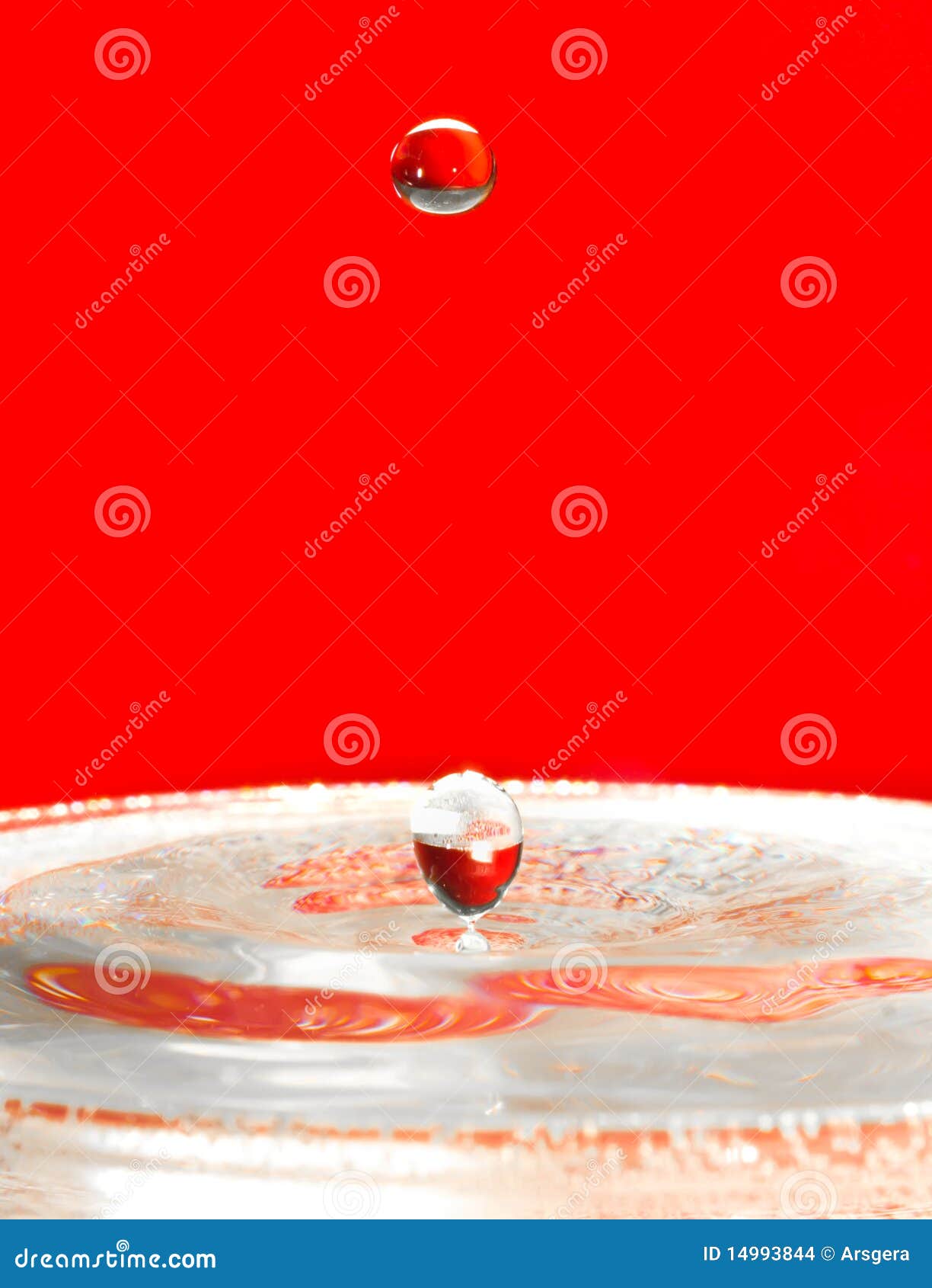 Falling Droplets of Water Over Red Stock Photo - Image of colorful ...