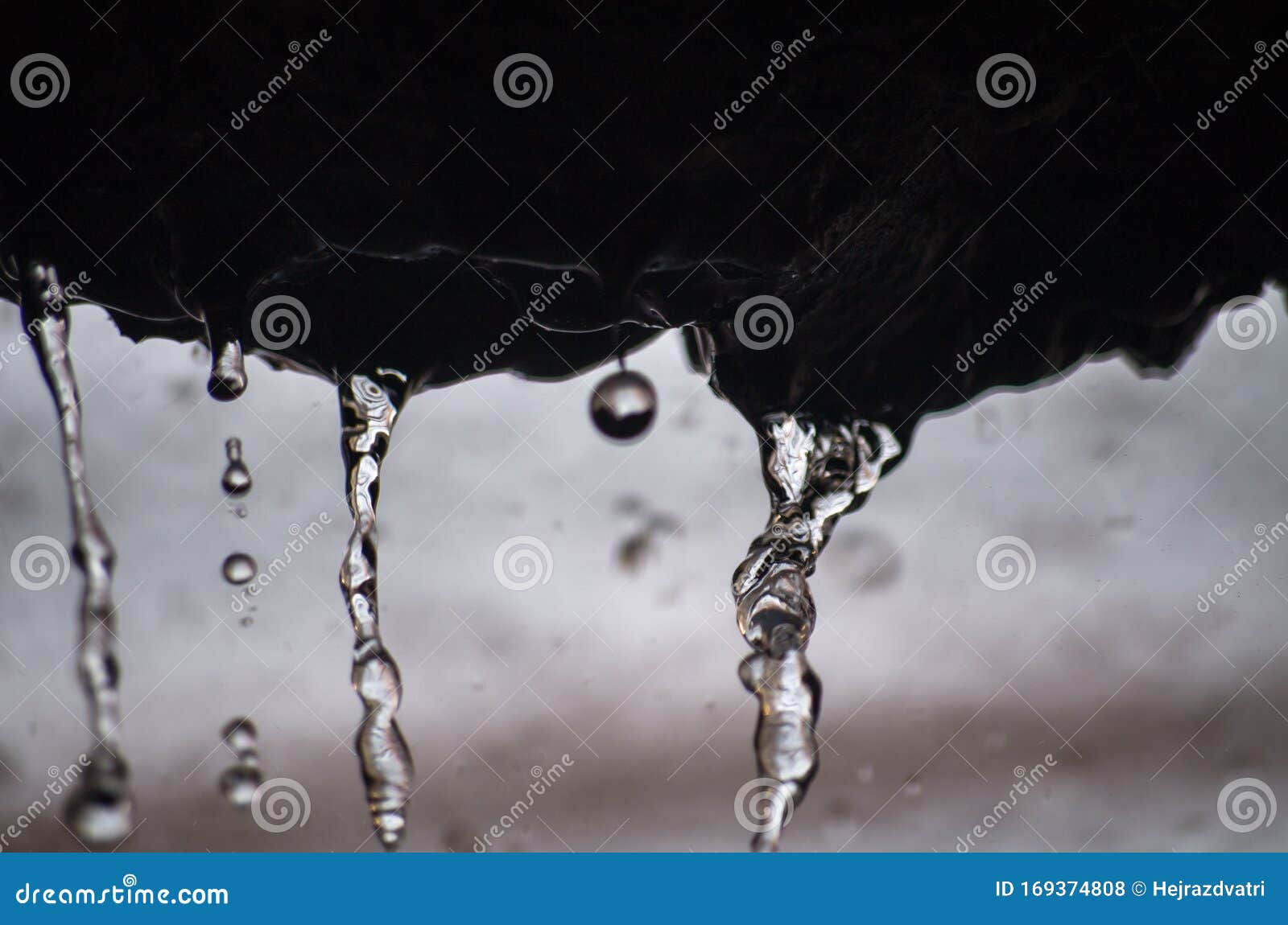 Falling water on a rock stock photo. Image of shape - 169374808