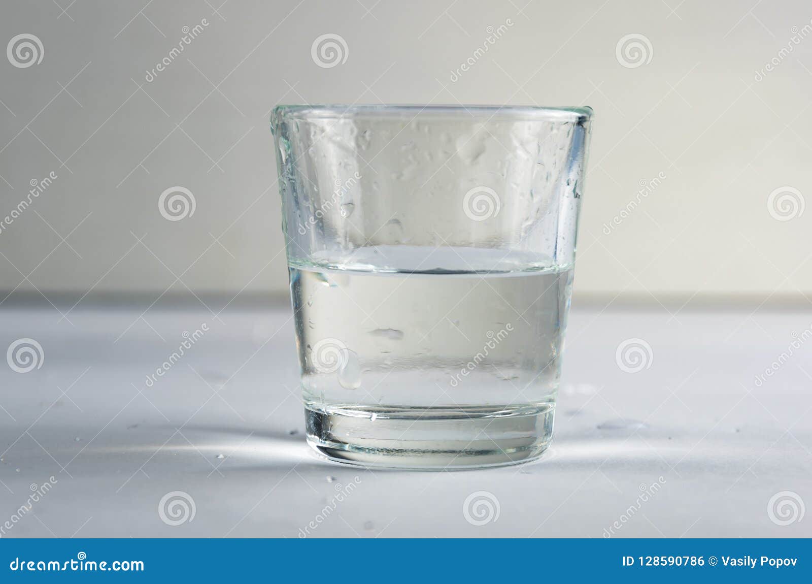 Falling, Flying or Standing Glass with a Clear Liquid Intended for ...