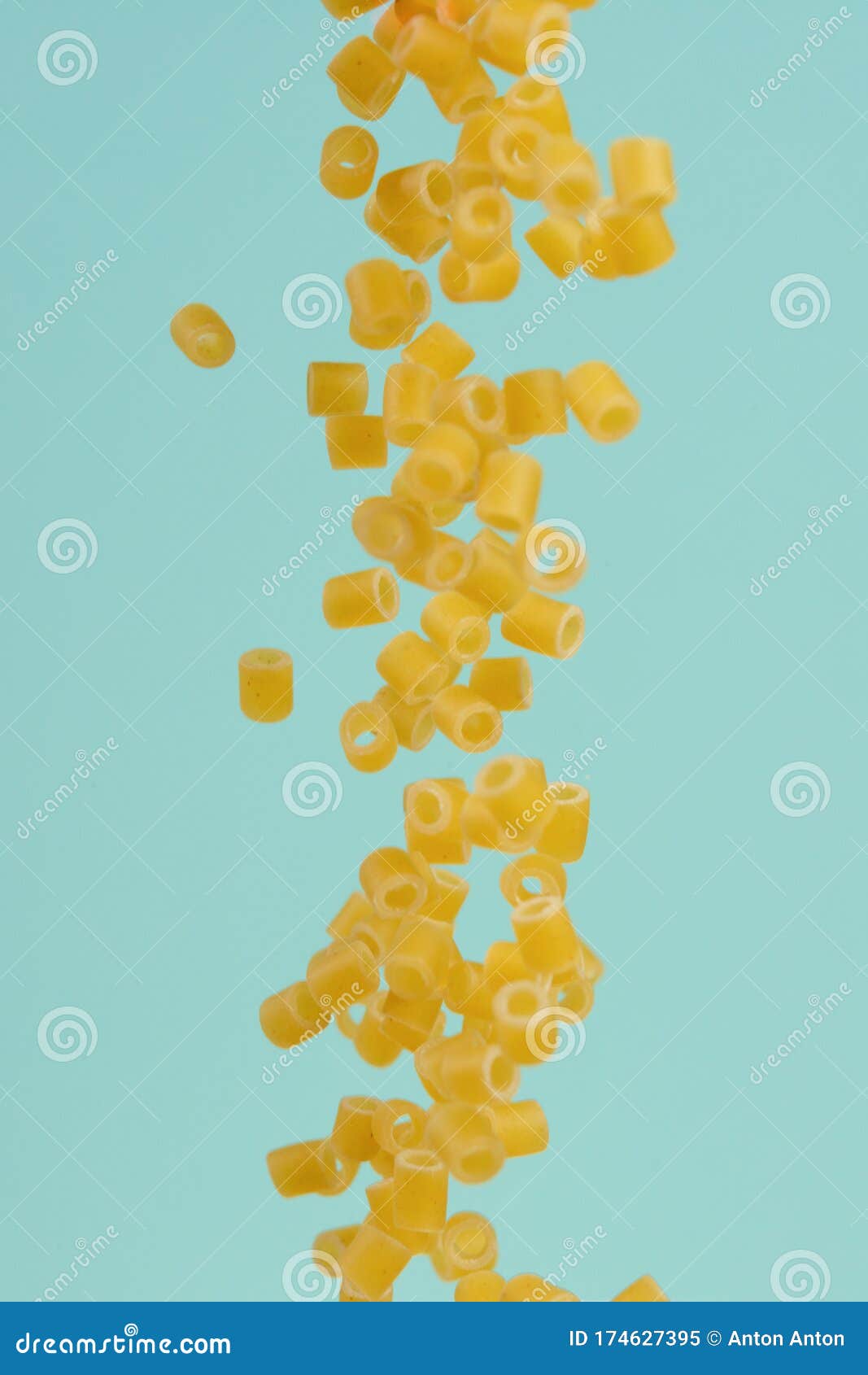 Falling Italian Pasta on a Light Blue Background, Freezing in Motion ...