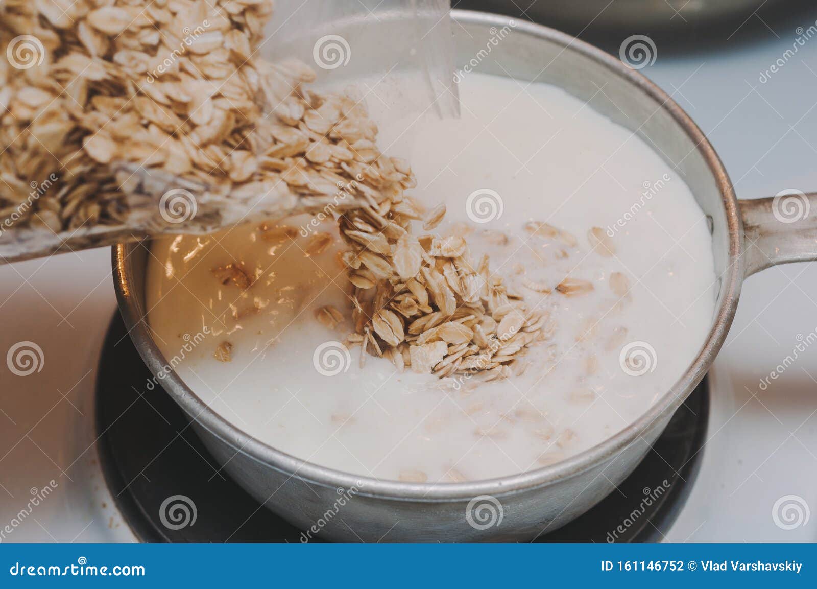 Falling Oatmeal into Hot Milk. Steaming Oatmeal Stock Photo - Image of ...