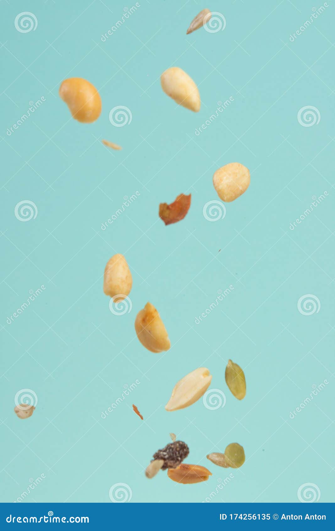 Falling Pieces of Nuts on a Light Blue Background, Freezing in Motion ...