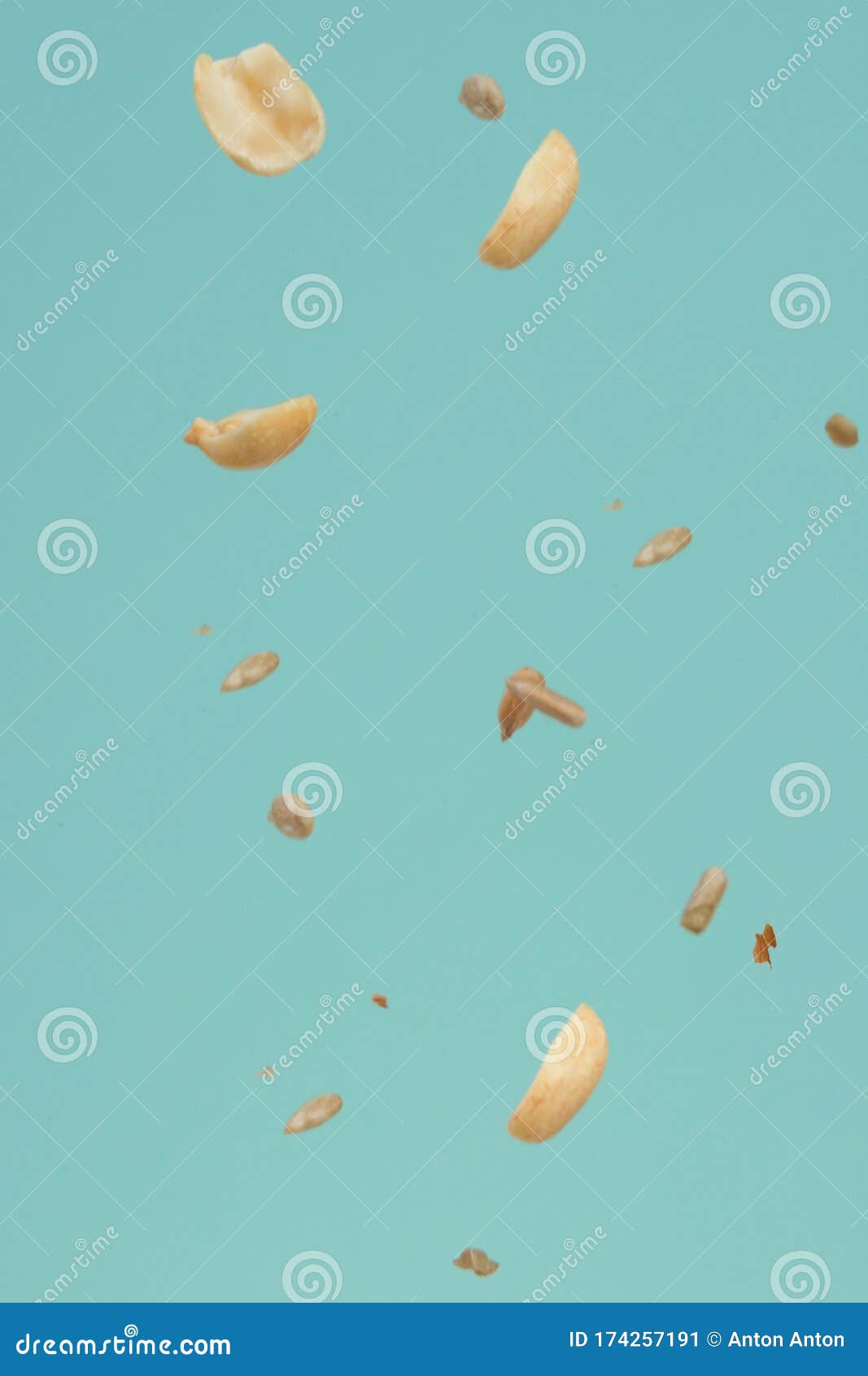 Falling Pieces of Nuts on a Light Blue Background, Freezing in Motion ...