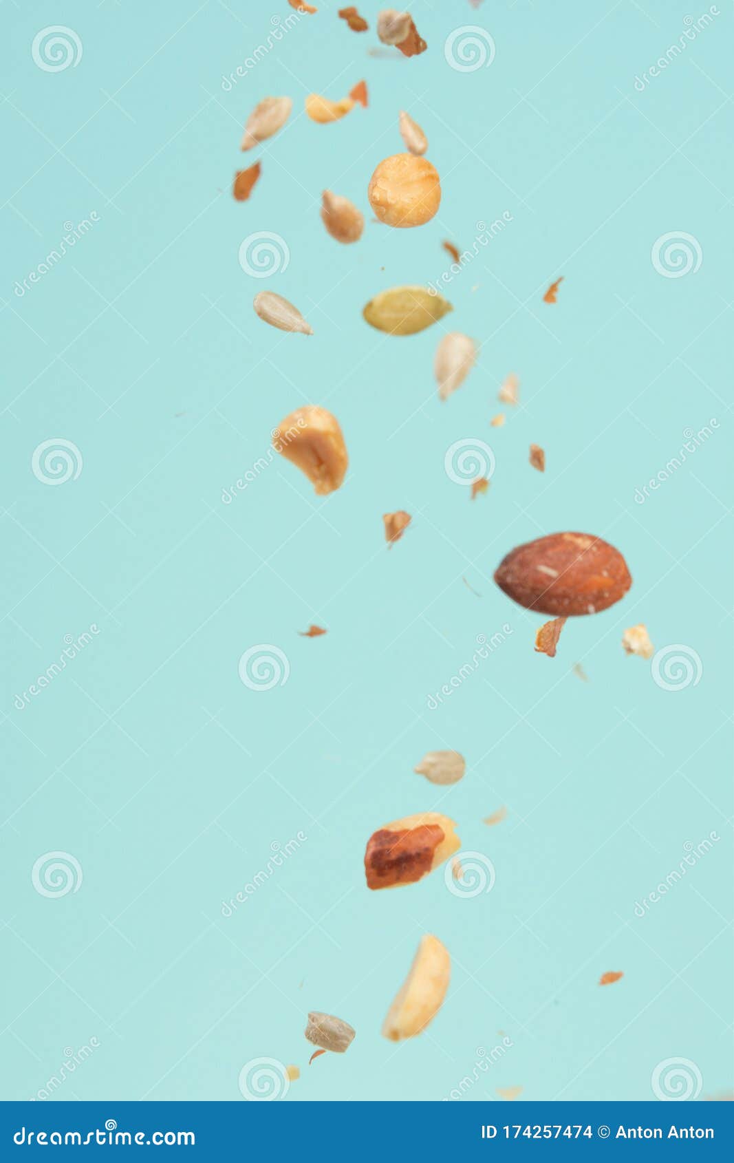 Falling Pieces of Nuts on a Light Blue Background, Freezing in Motion ...