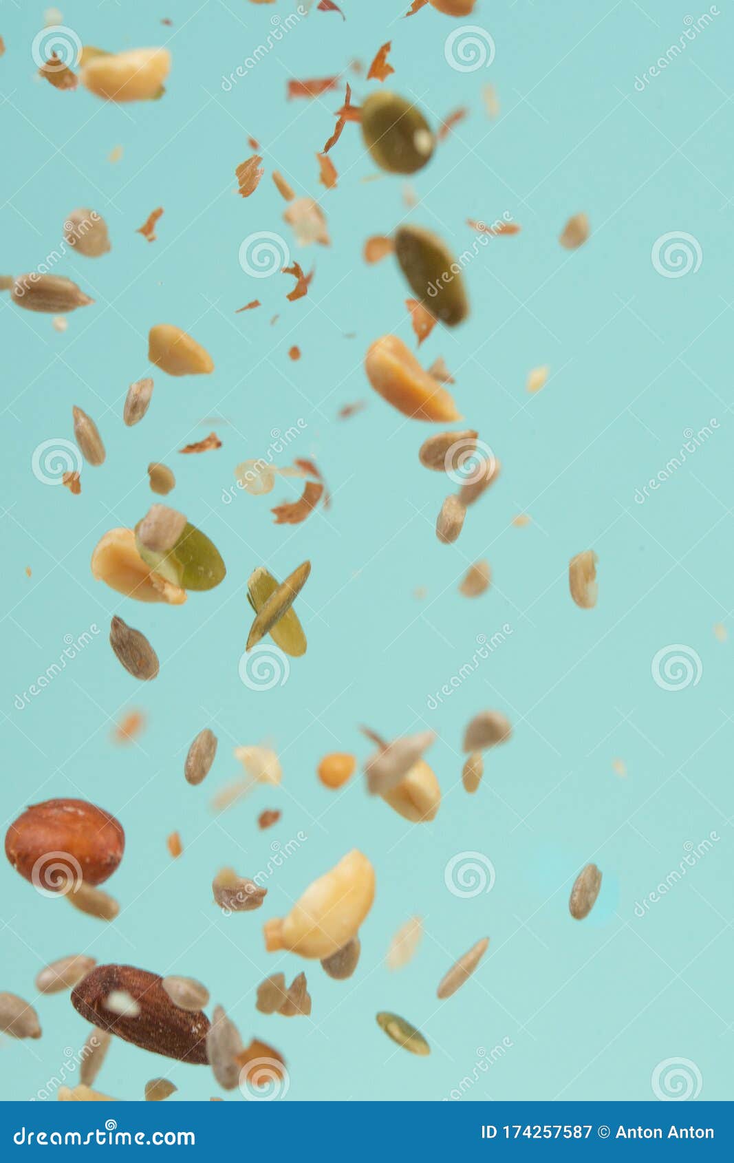 Falling Pieces of Seeds, Nuts and Raisins on a Light Background ...