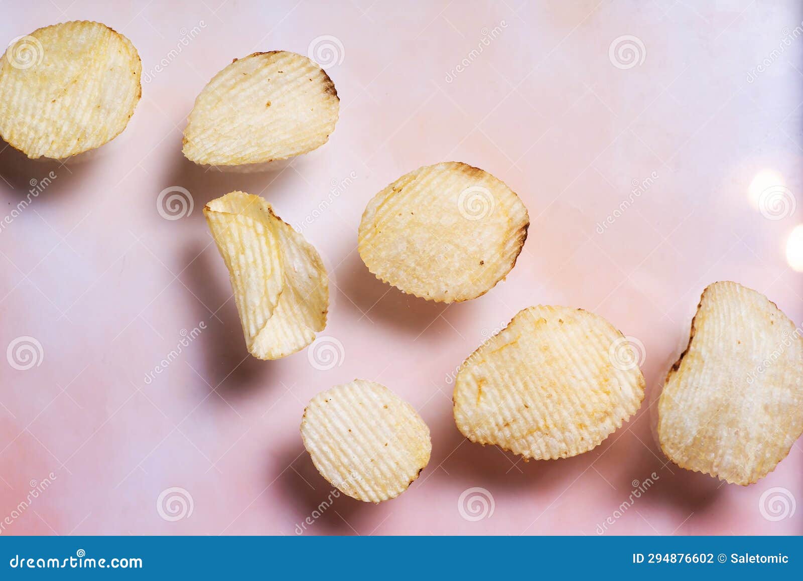 Falling potato chips stock photo. Image of gastronomy - 294876602