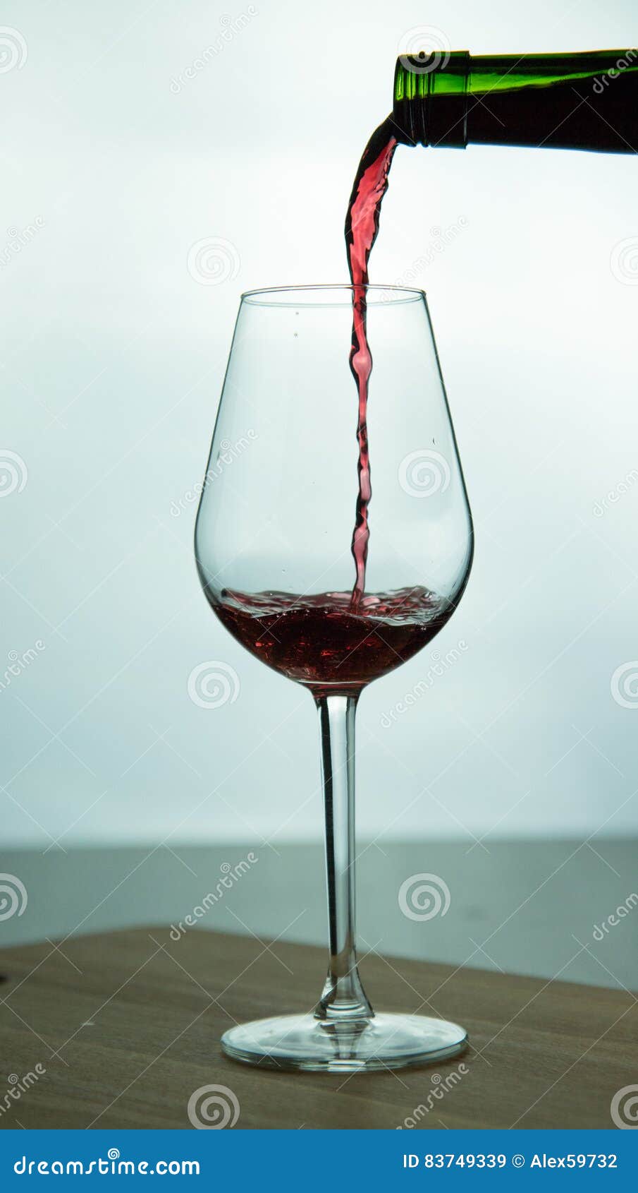 Falling red wine in glass stock image. Image of black - 83749339
