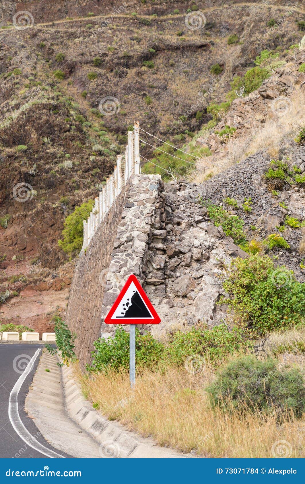 Falling Rocks Warning Road Sign Stock Photo - Image of safe, curve ...