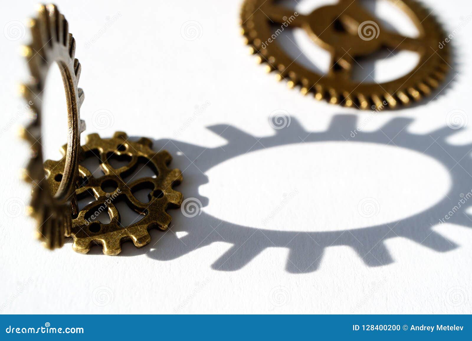 The Falling Shadow of the Gears on the White Background and Other Gears ...