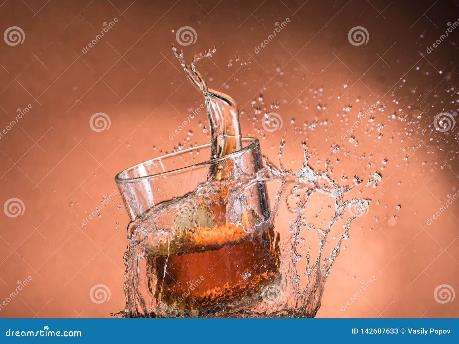 Falling Small Glasses and Spilling Water on a Green Background Stock ...
