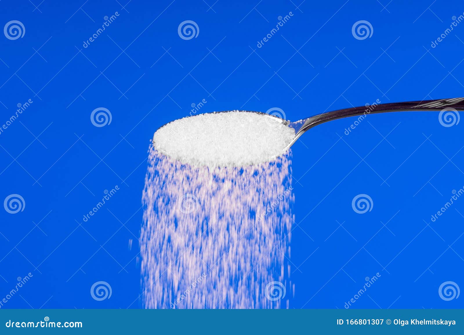 Falling Sugar from a Spoon on a Blue Background Stock Image - Image of ...