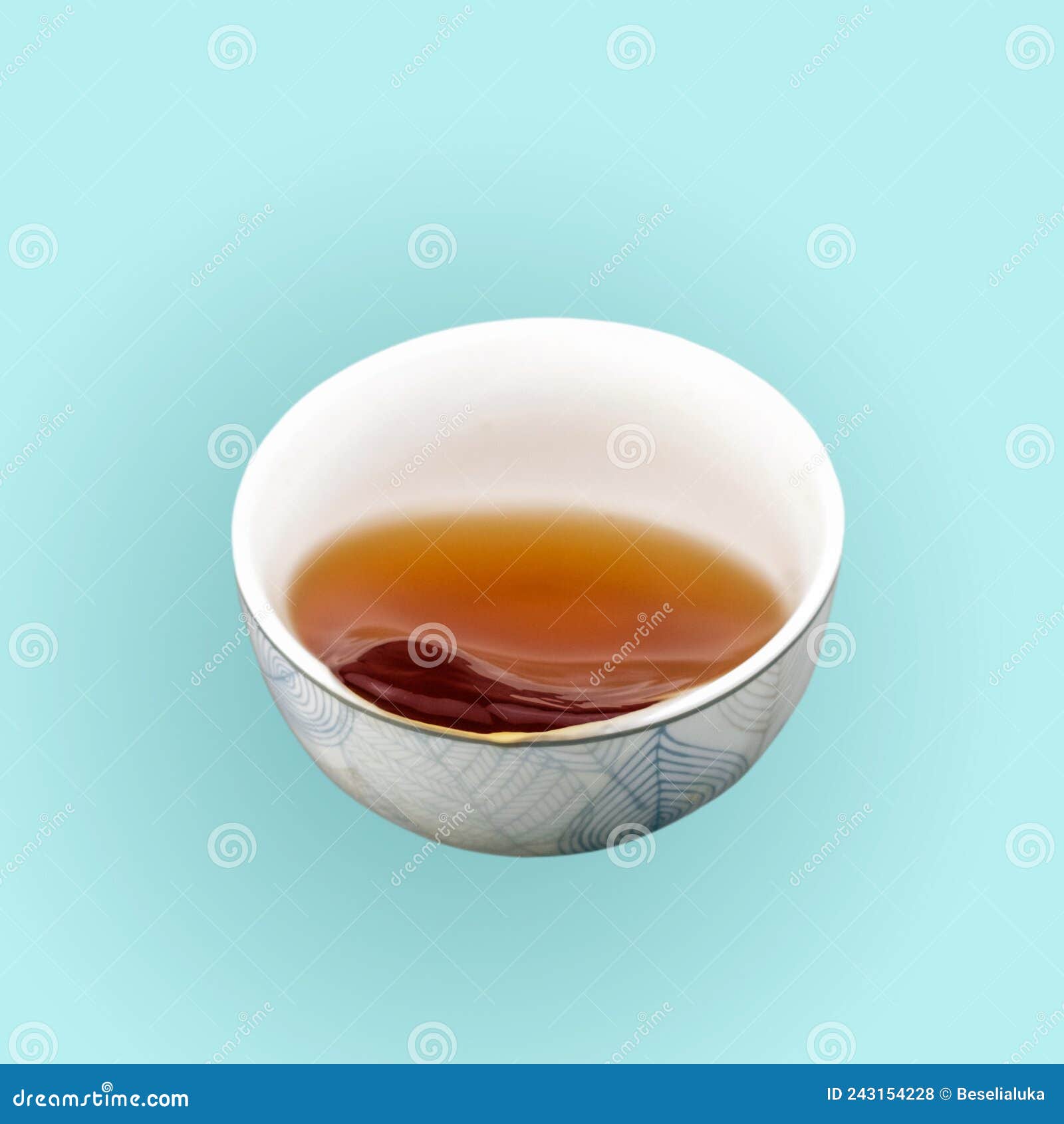 A falling teacup with tea stock photo. Image of beverage - 243154228
