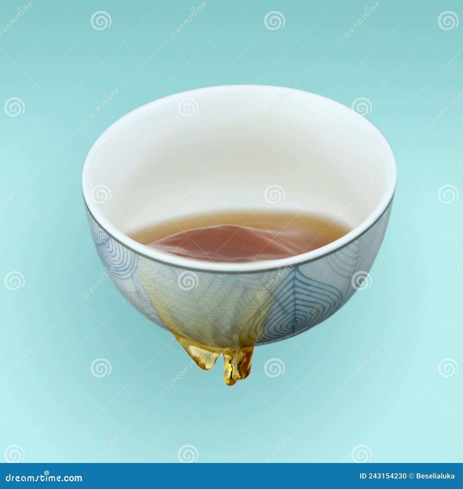 A falling teacup with tea stock photo. Image of morning - 243154230