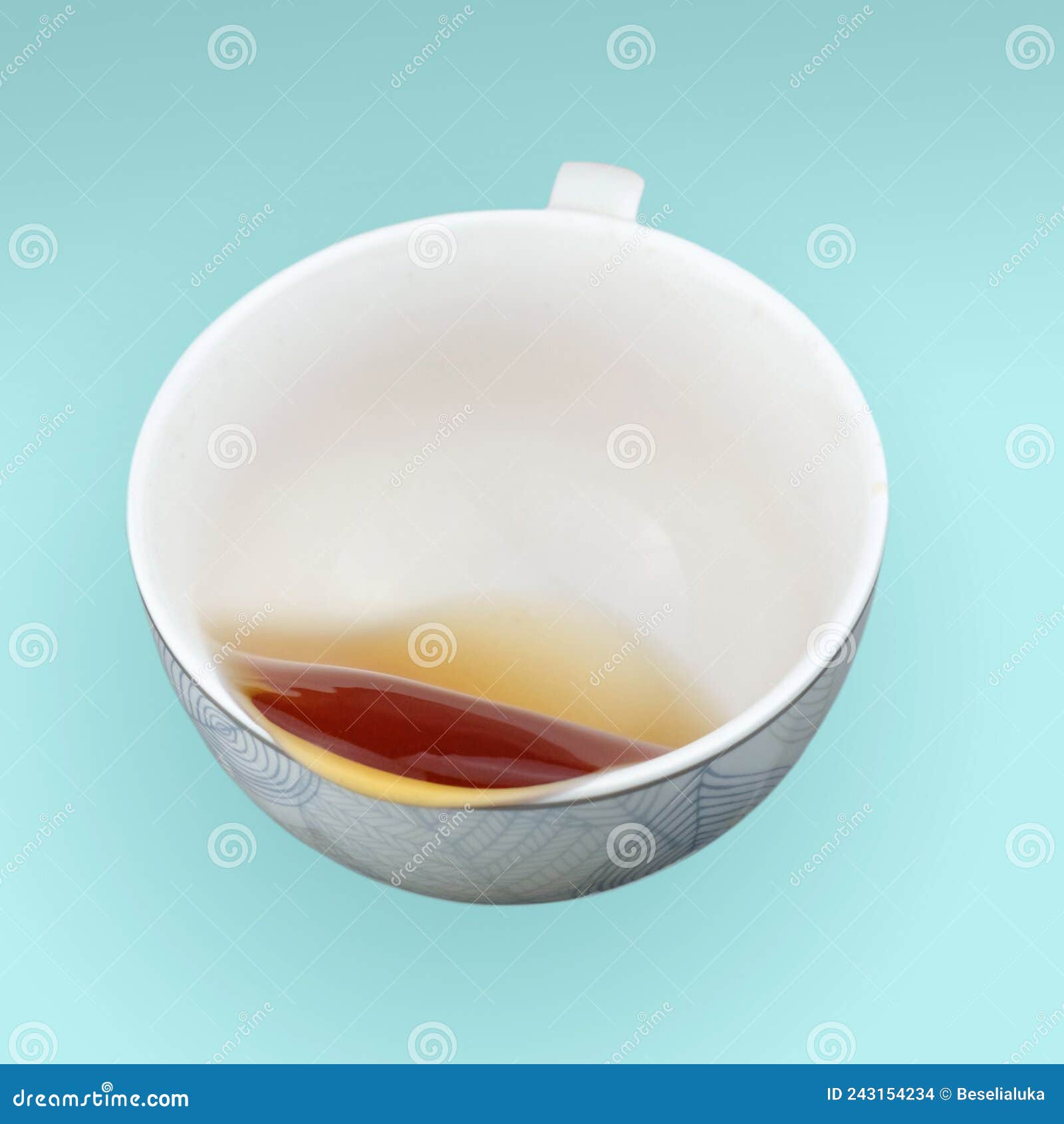A falling teacup with tea stock photo. Image of object - 243154234