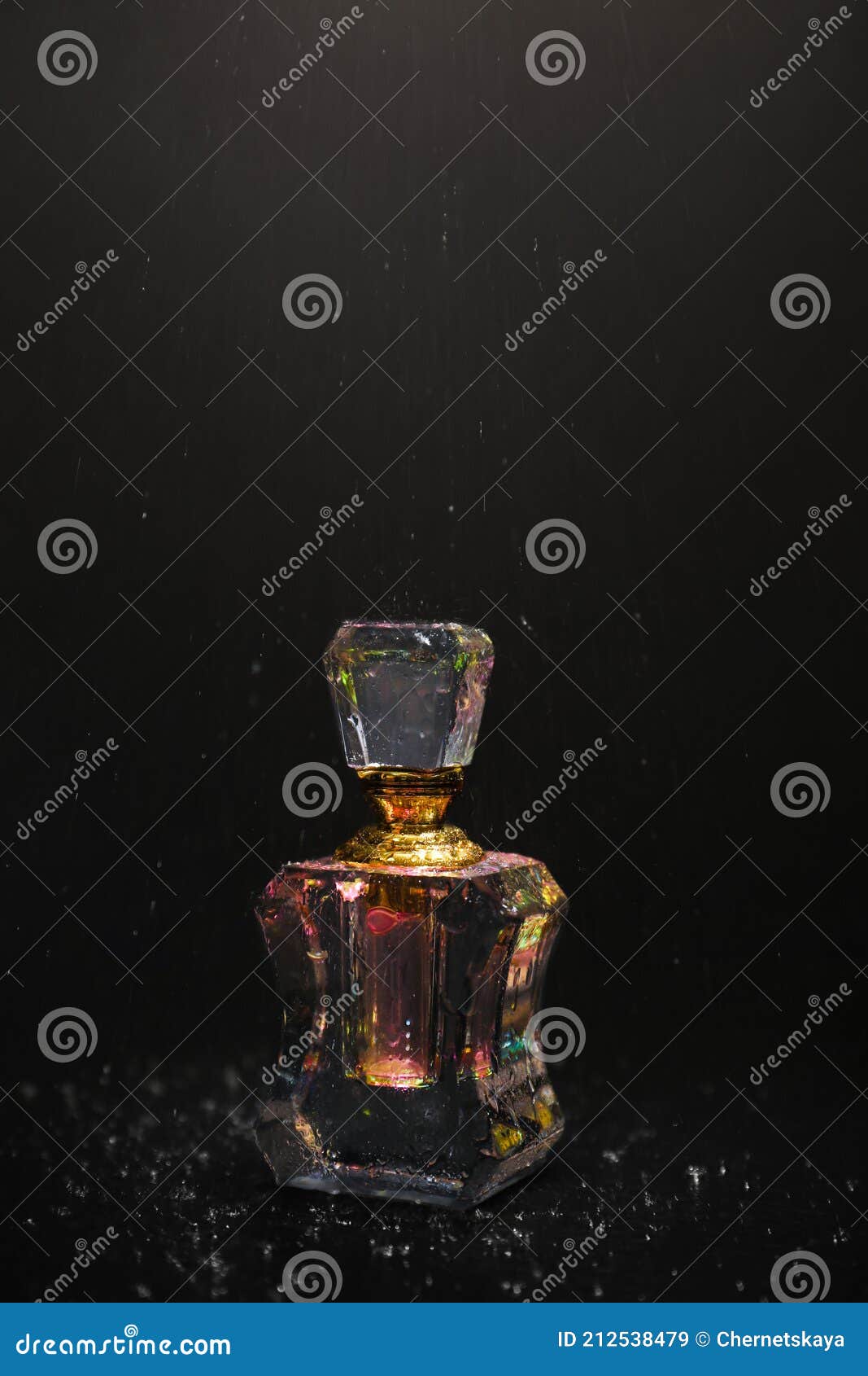 Falling Water Drops Over Perfume Bottle on Dark Background Stock Image ...