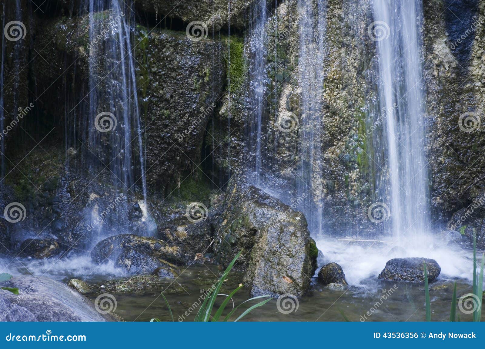 Falling water on stones stock photo. Image of outside - 43536356